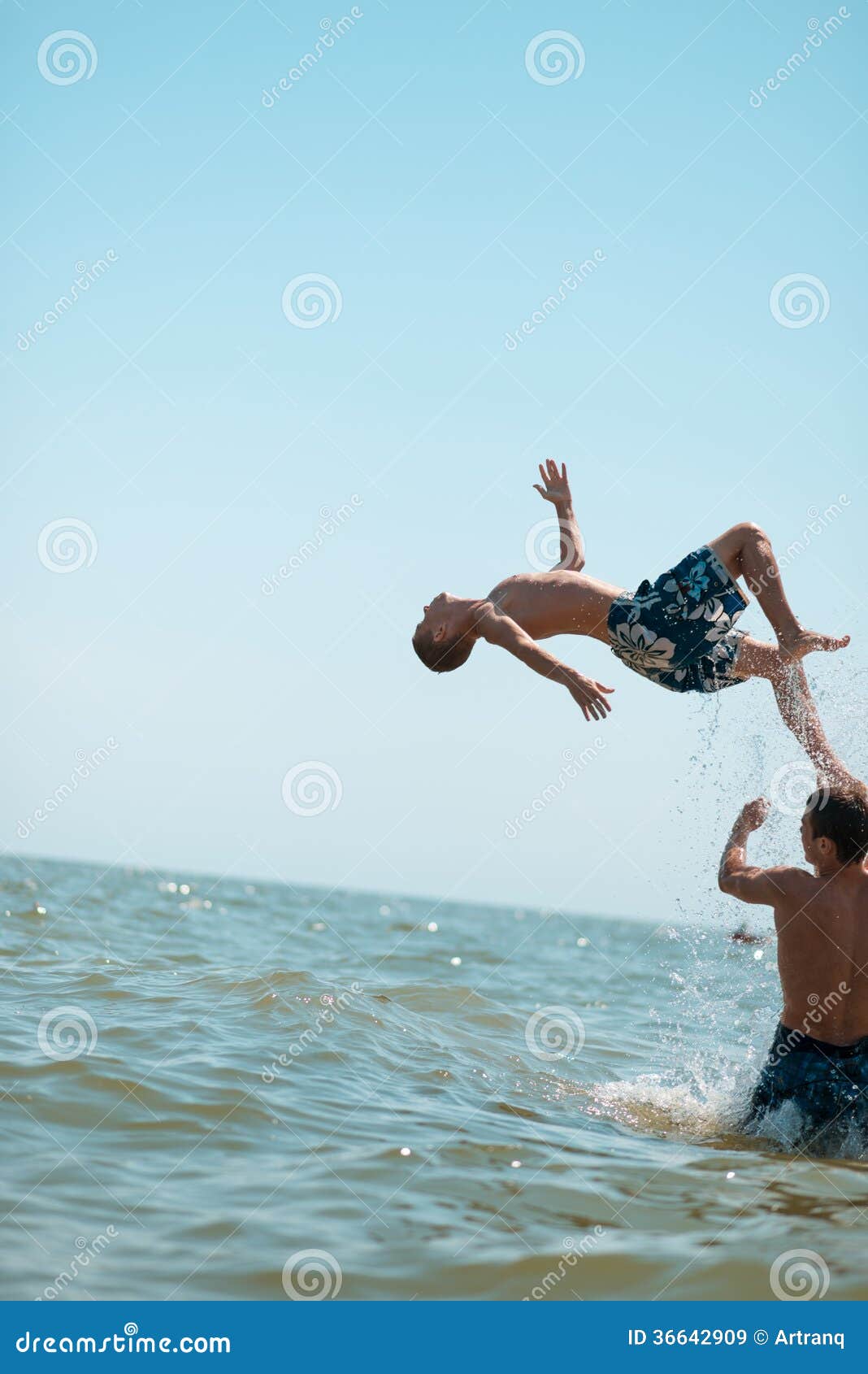 Group of Guys Standing in the Sea Tossed Up Man Stock Image - Image of ...