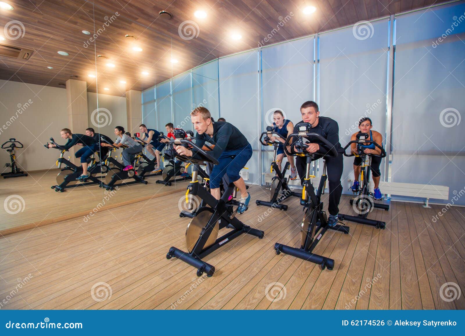 Group of Gym People on Machines, Cycling in Class Stock Photo - Image ...