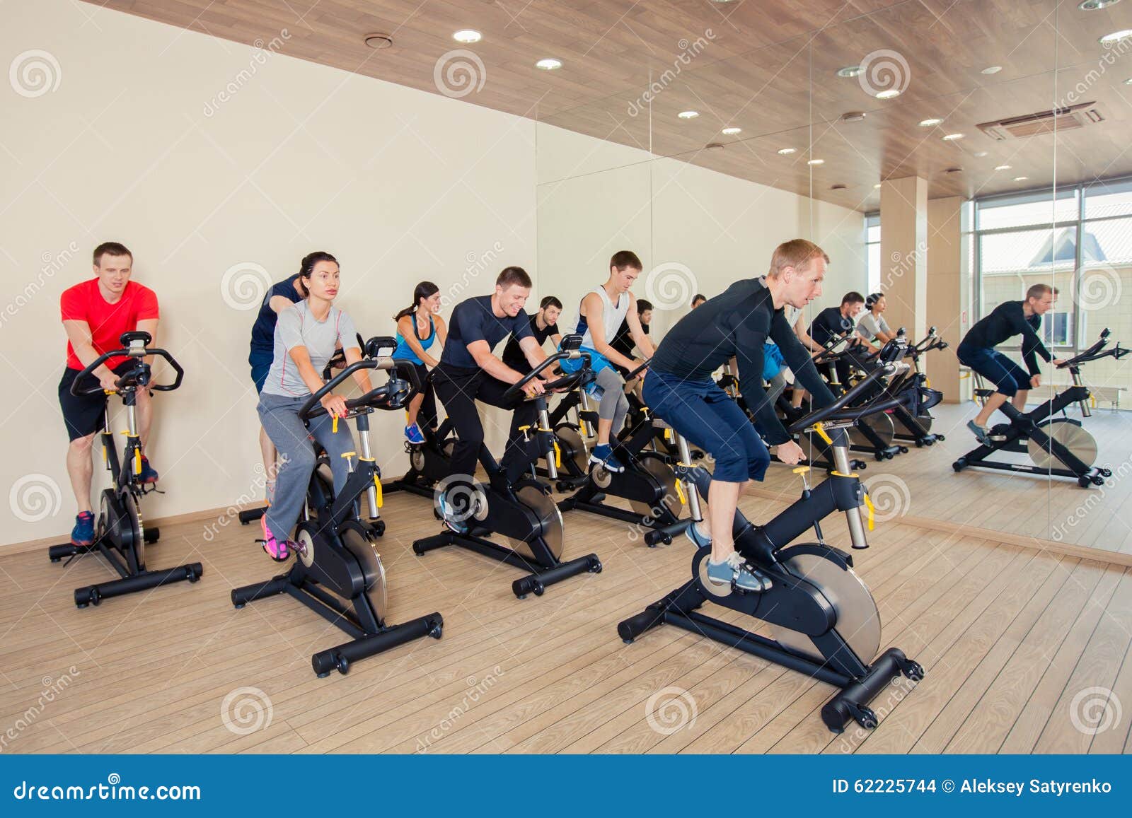 Group of Gym People on Machines, Cycling in Class Stock Photo - Image ...