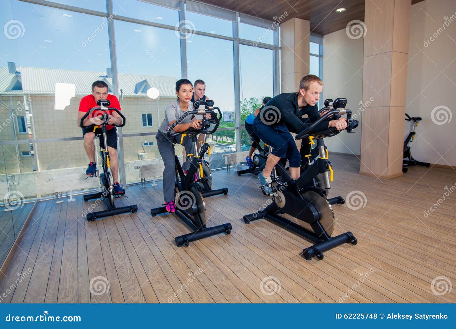 Group of Gym People on Machines, Cycling in Class Stock Photo - Image ...