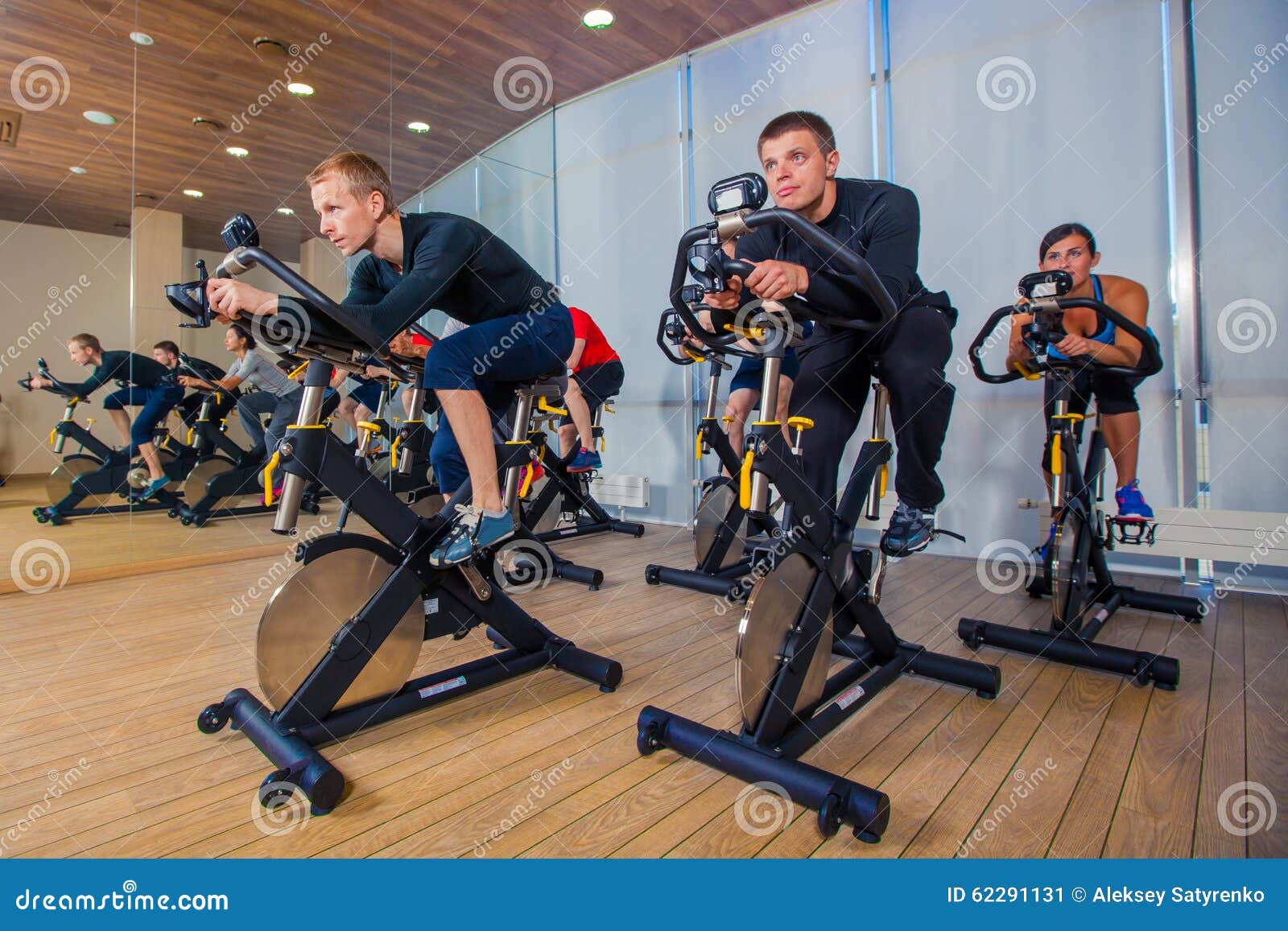 Group of Gym People on Machines, Cycling in Class Stock Image - Image ...