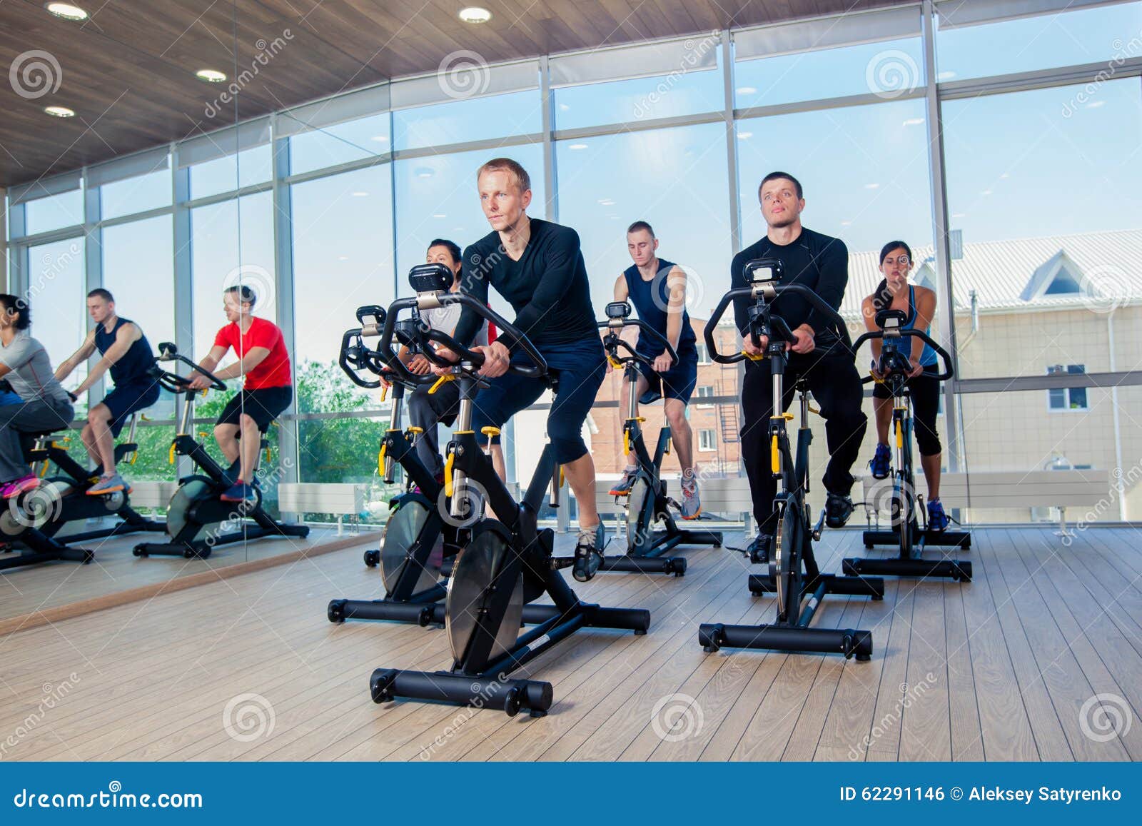 Group of Gym People on Machines, Cycling in Class Stock Photo - Image ...