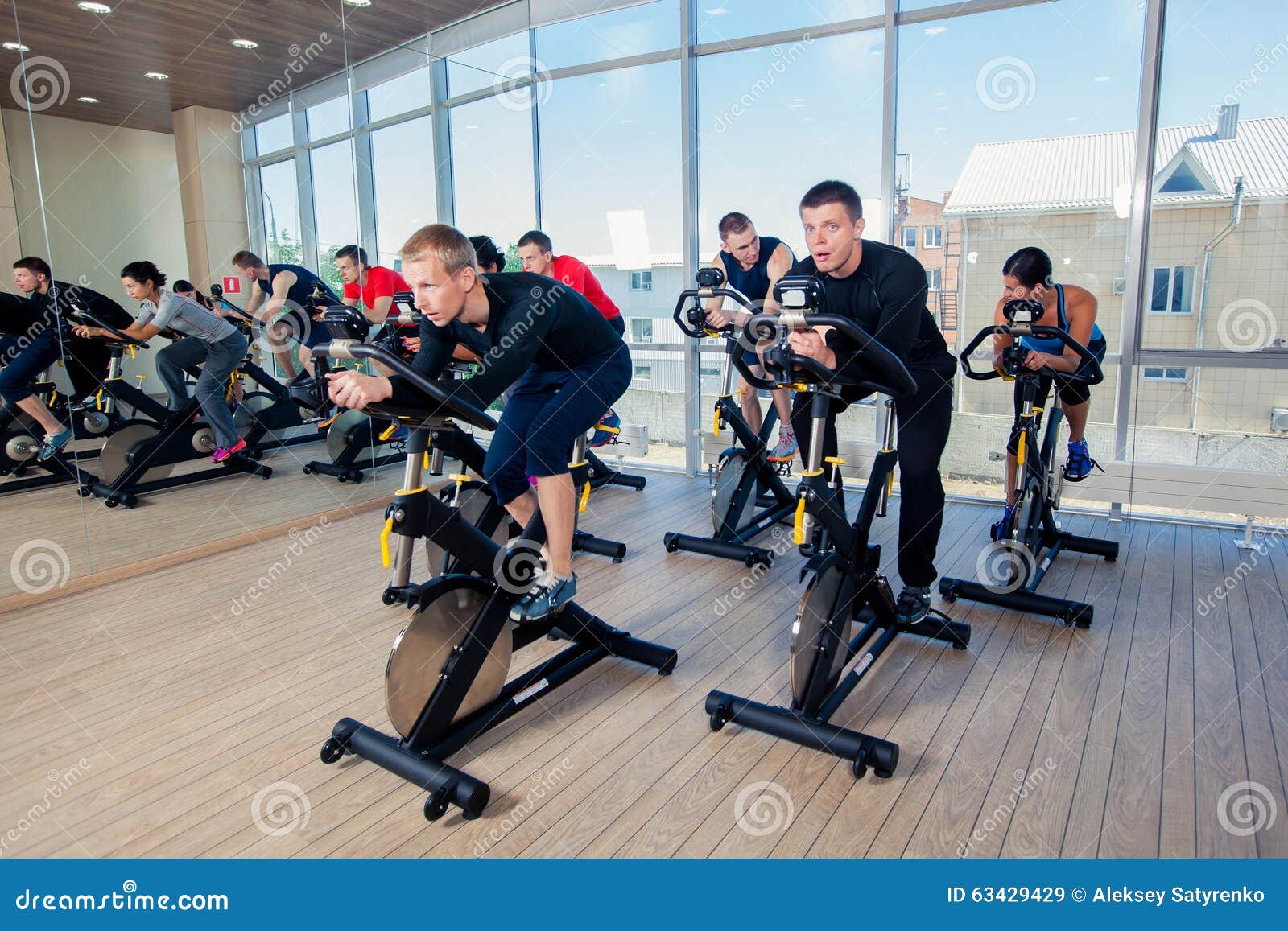 Group of Gym People on Machines, Cycling in Class Stock Image - Image ...