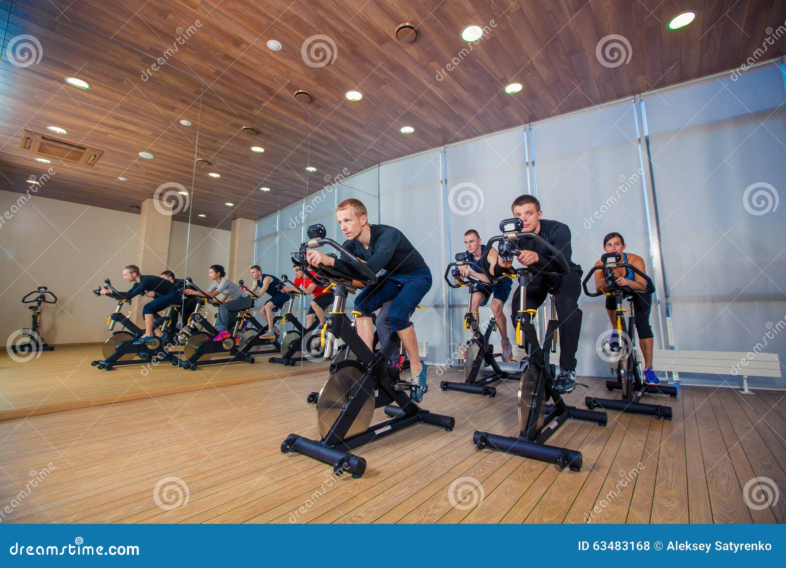 Group of Gym People on Machines, Cycling in Class Stock Photo - Image ...