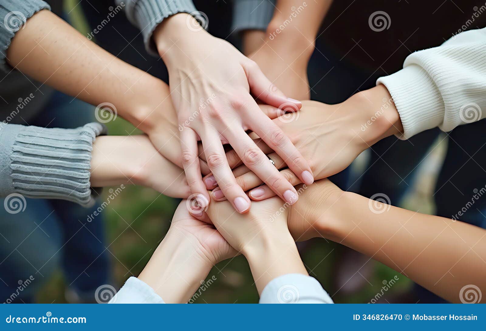 A Group of Hands Interlocked in a Circle, Symbolizing Teamwork, Unity ...
