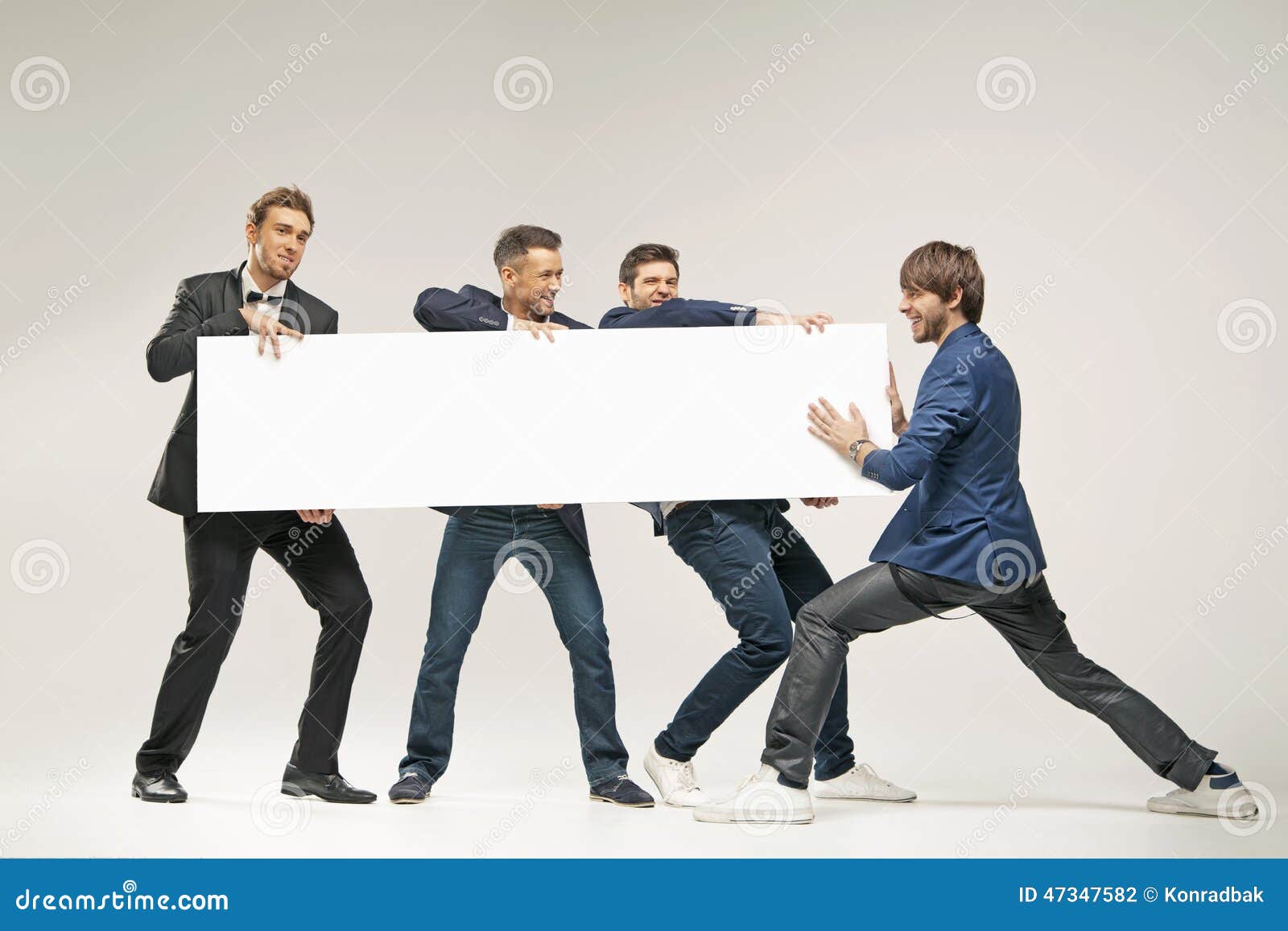Group of Handsome Men Pushing Board Stock Photo - Image of blank ...
