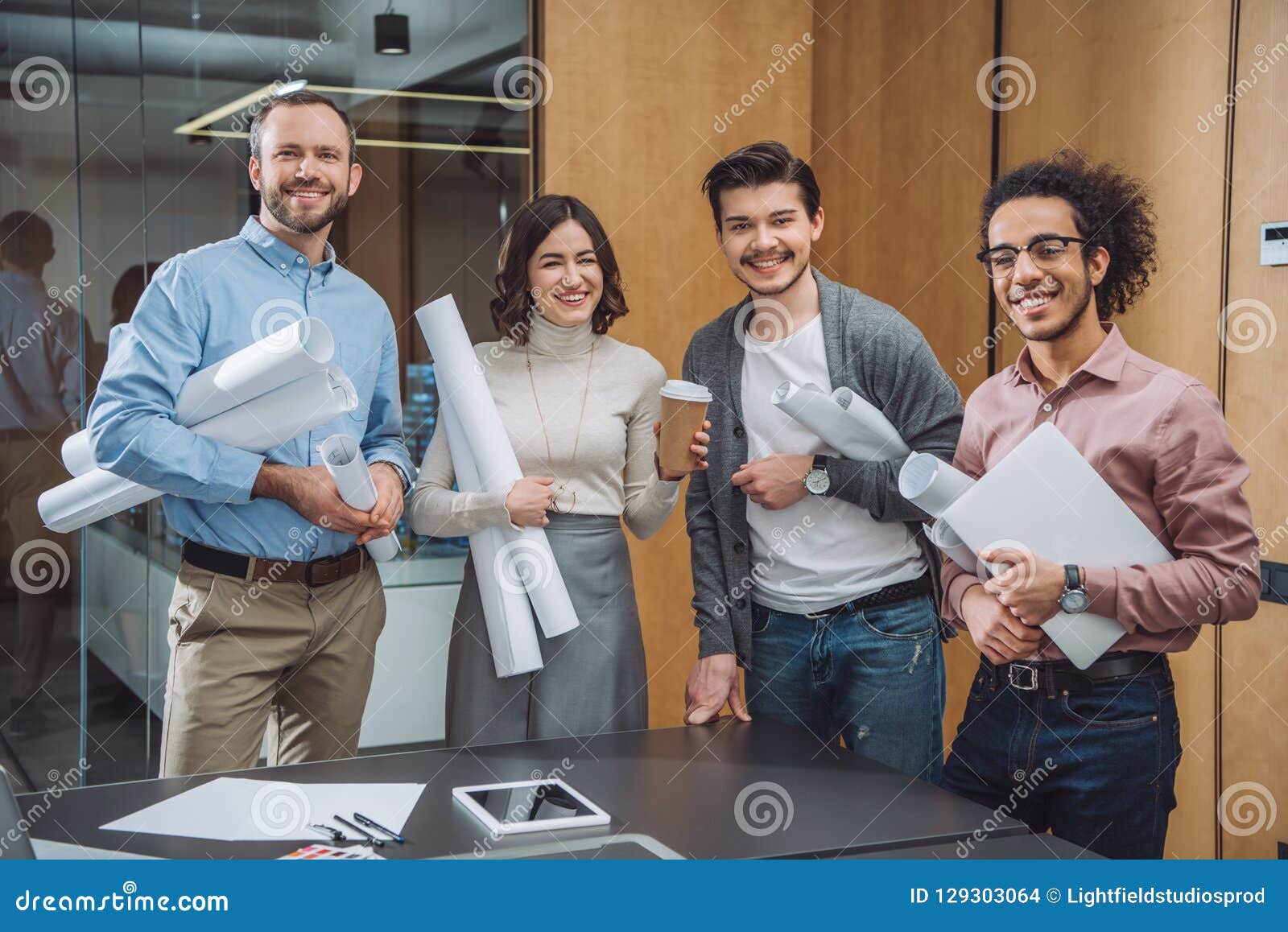 Group of Happy Architects with Rolled Plans Stock Photo - Image of ...