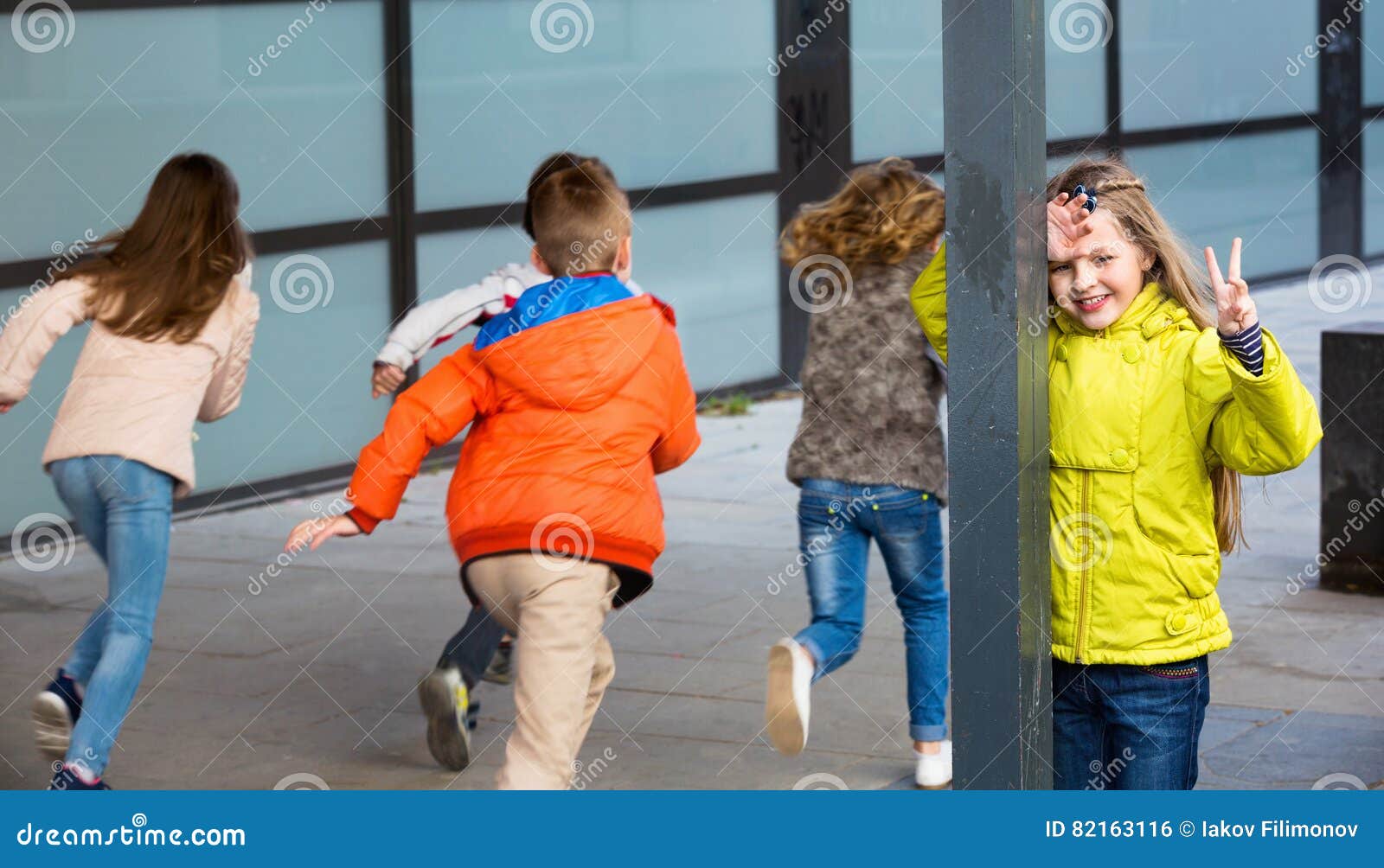 Group of Happy Children Playing at Hide-and-seek Stock Photo - Image of ...