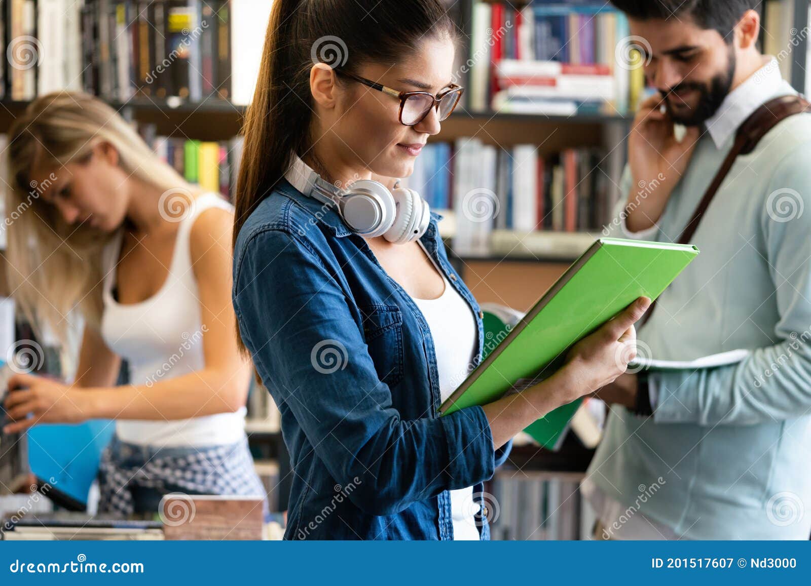 Group of Happy College Students Studying at Campus Library Together ...