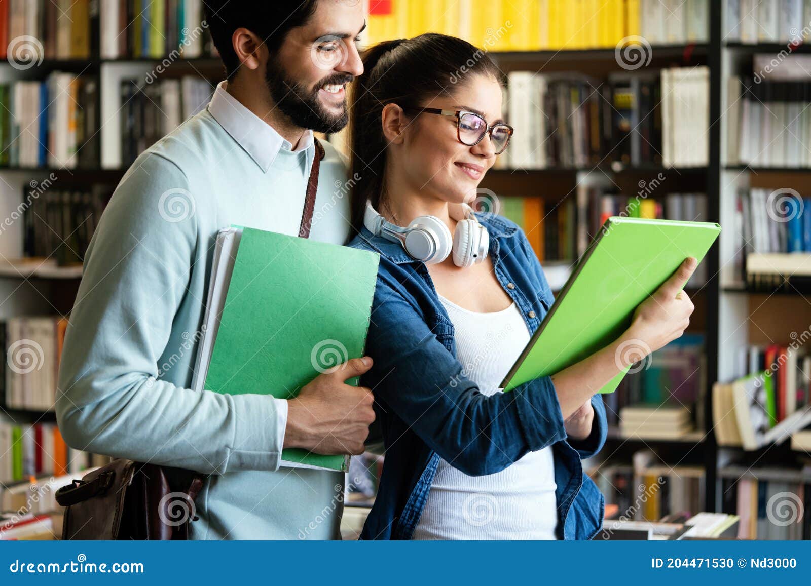 Group of Happy College Students Studying at Campus Library Together ...