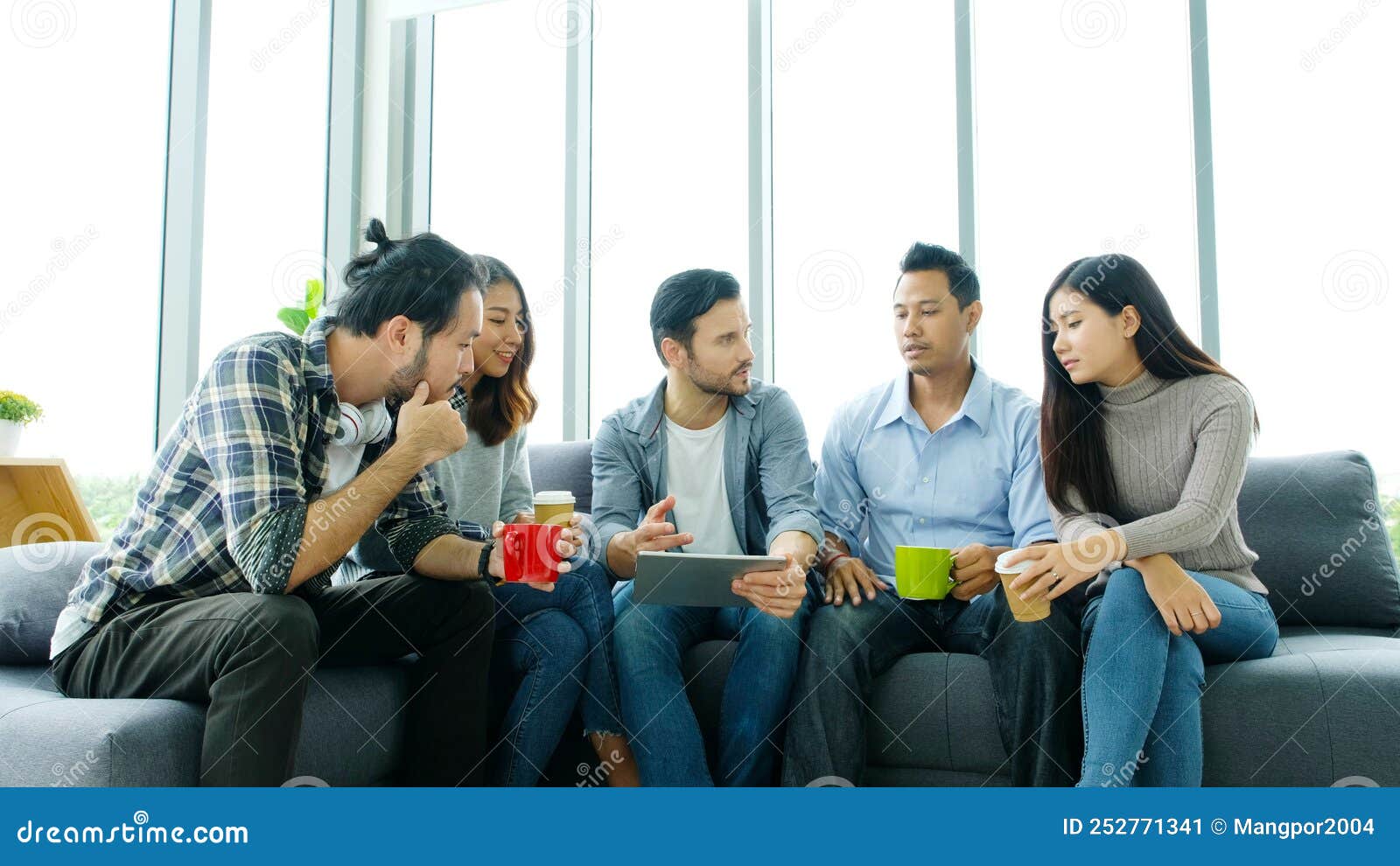 Group of Happy Creative Team Discussinng while Taking Coffee Break at ...