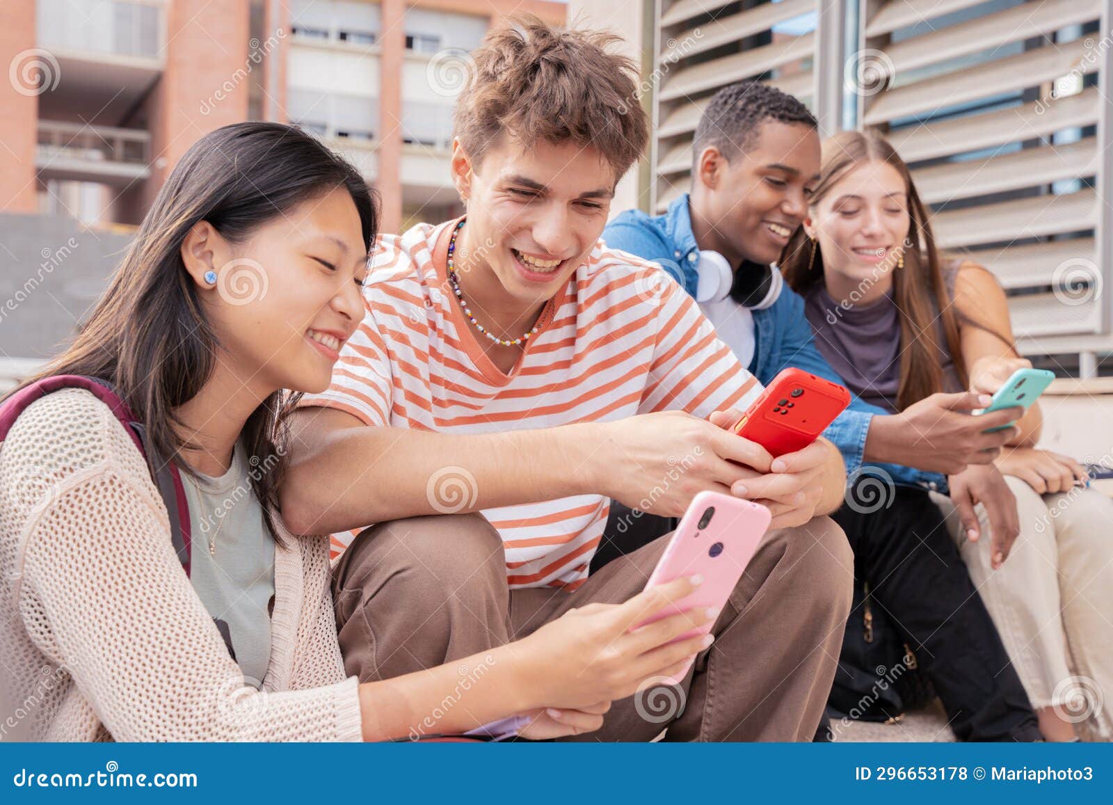 Group of Happy Friends Browsing an Internet Application with a ...