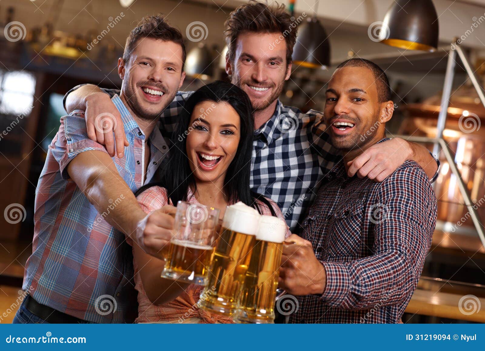 Group Of Happy Friends Clinking With Beer In Pub Stock Images - Image ...