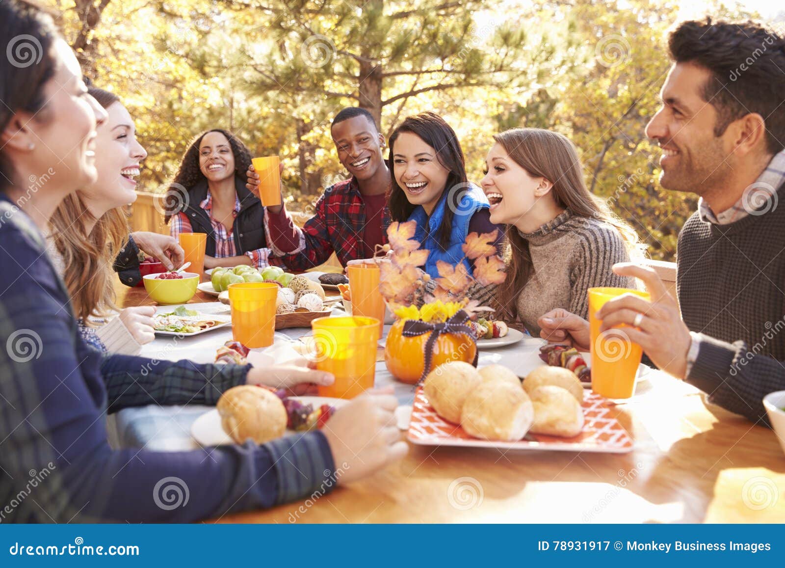 Group of Happy Friends Eat and Laugh at a Table at a Barbecue Stock ...