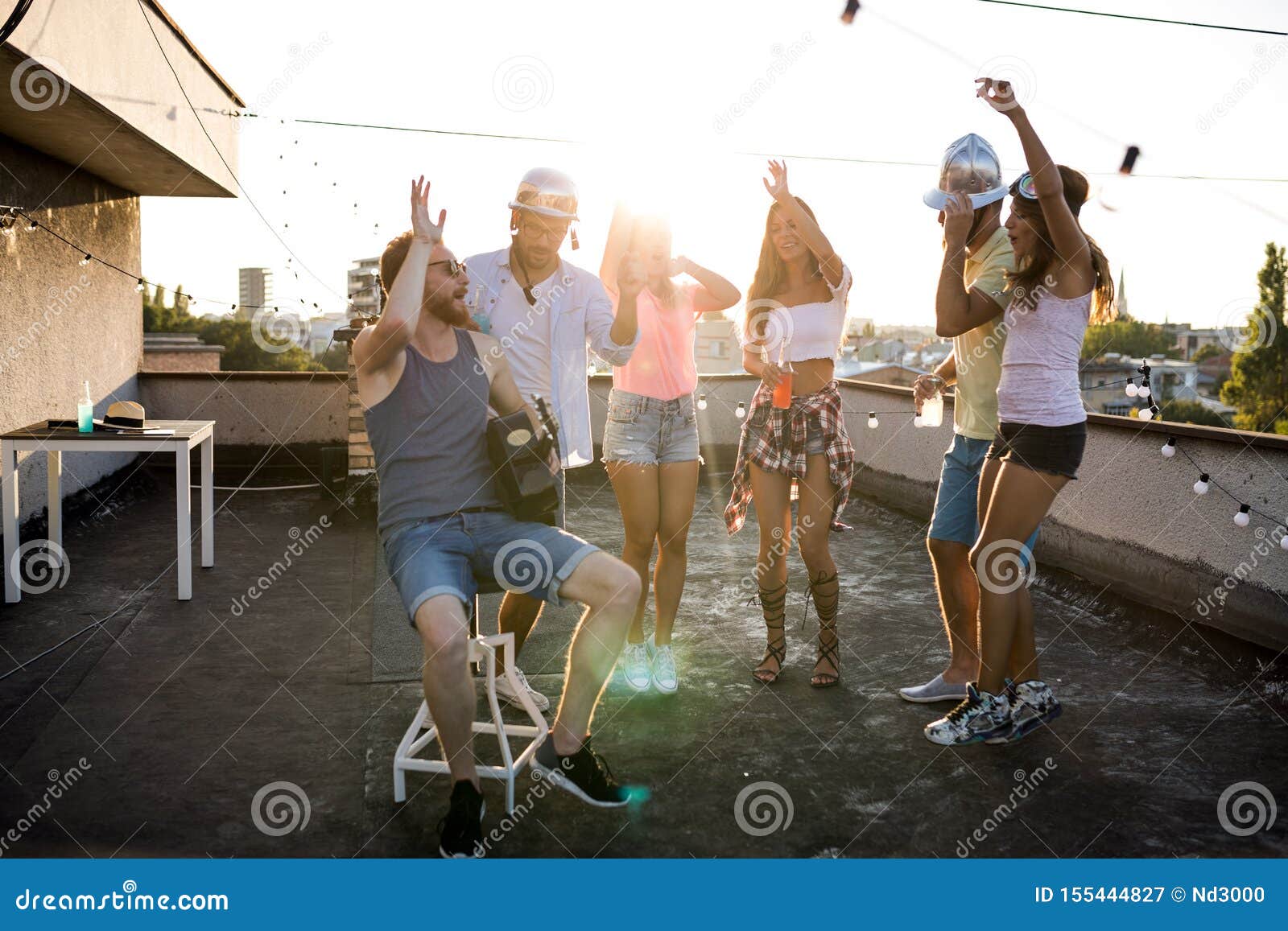 Group of Happy Friends Having Party on Rooftop Stock Image - Image of ...