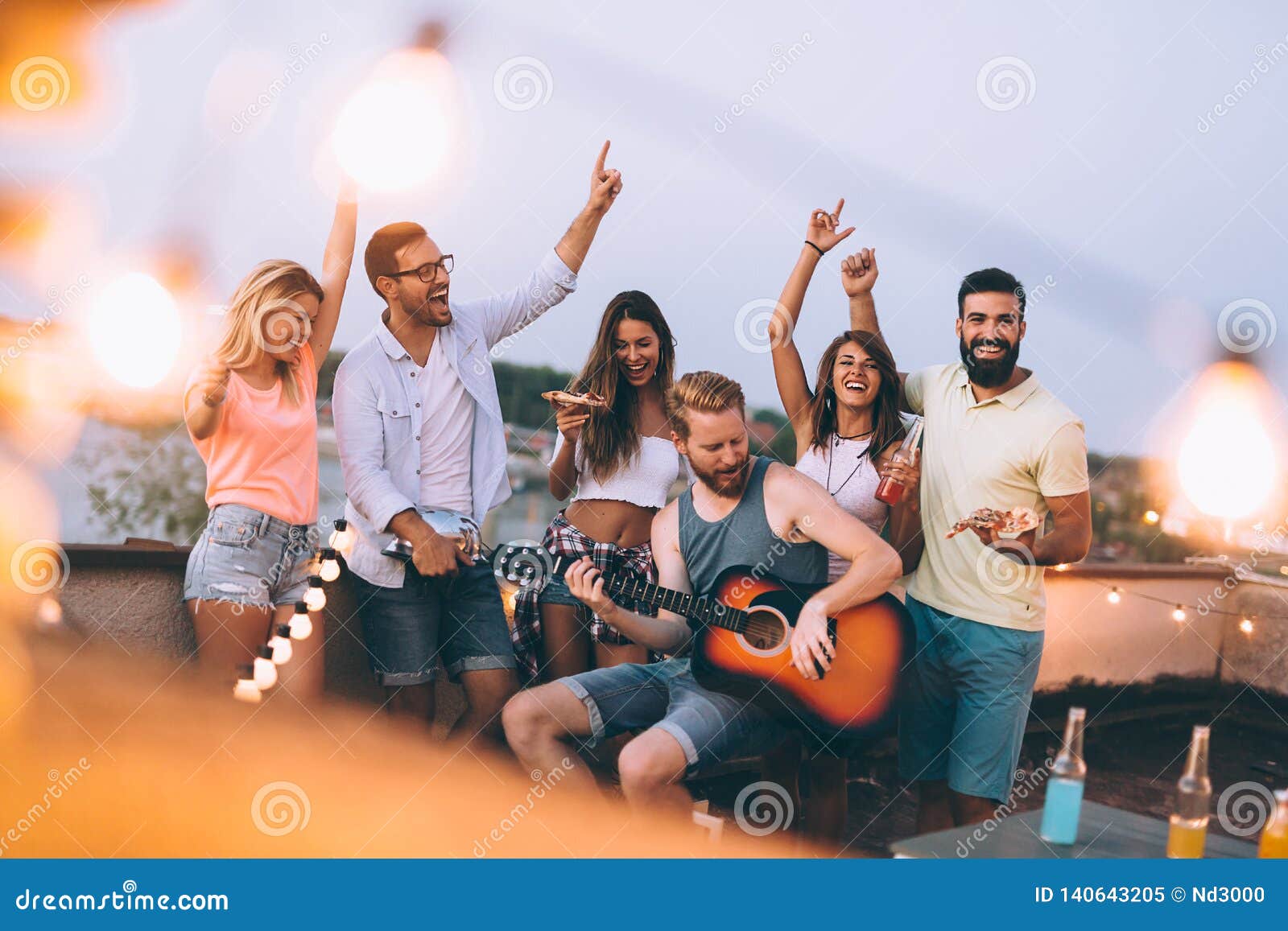 Group of Happy Friends Having Party on Rooftop Stock Image - Image of ...