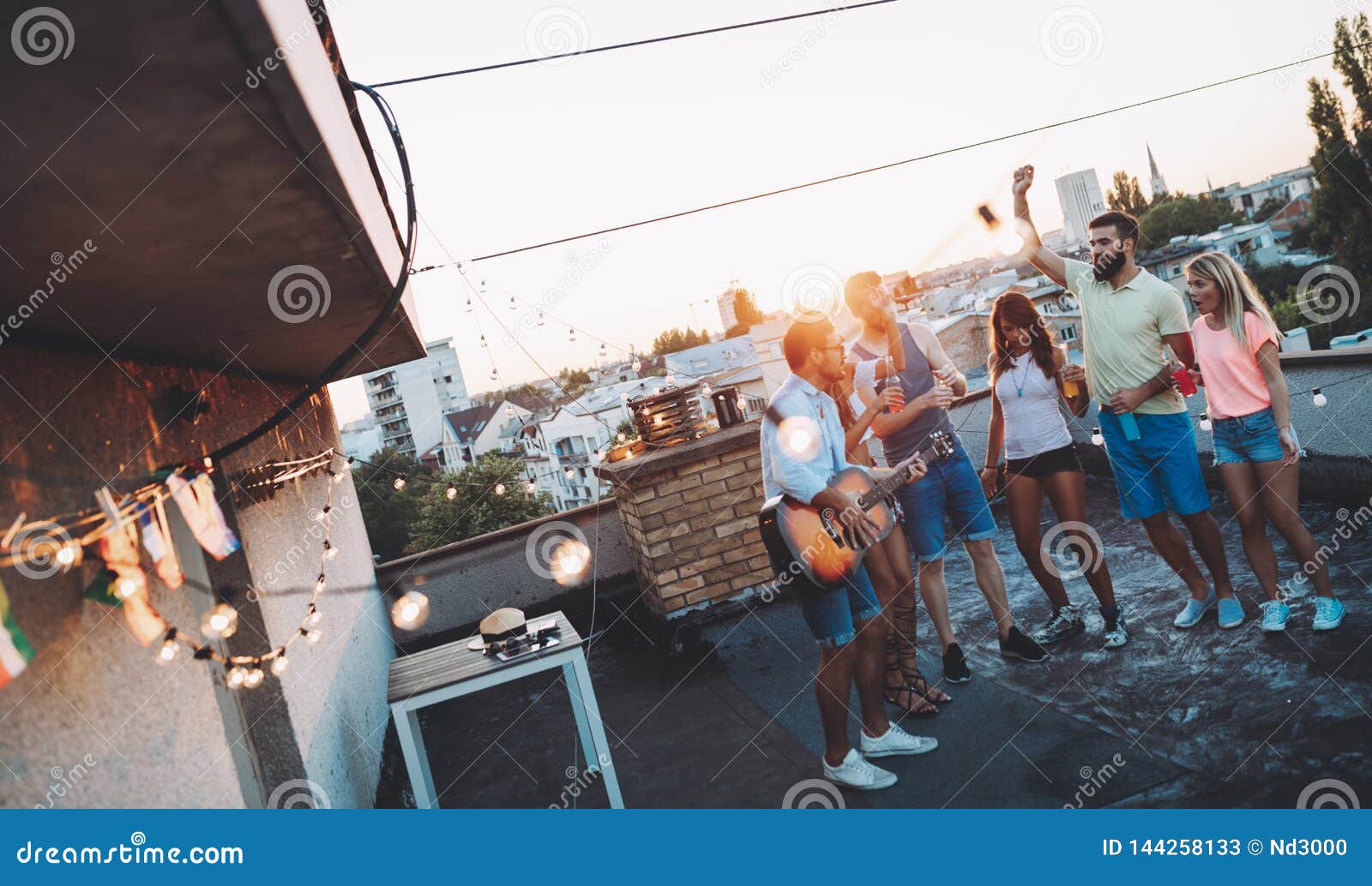 Group of Happy Friends Having Party on Rooftop Stock Image - Image of ...