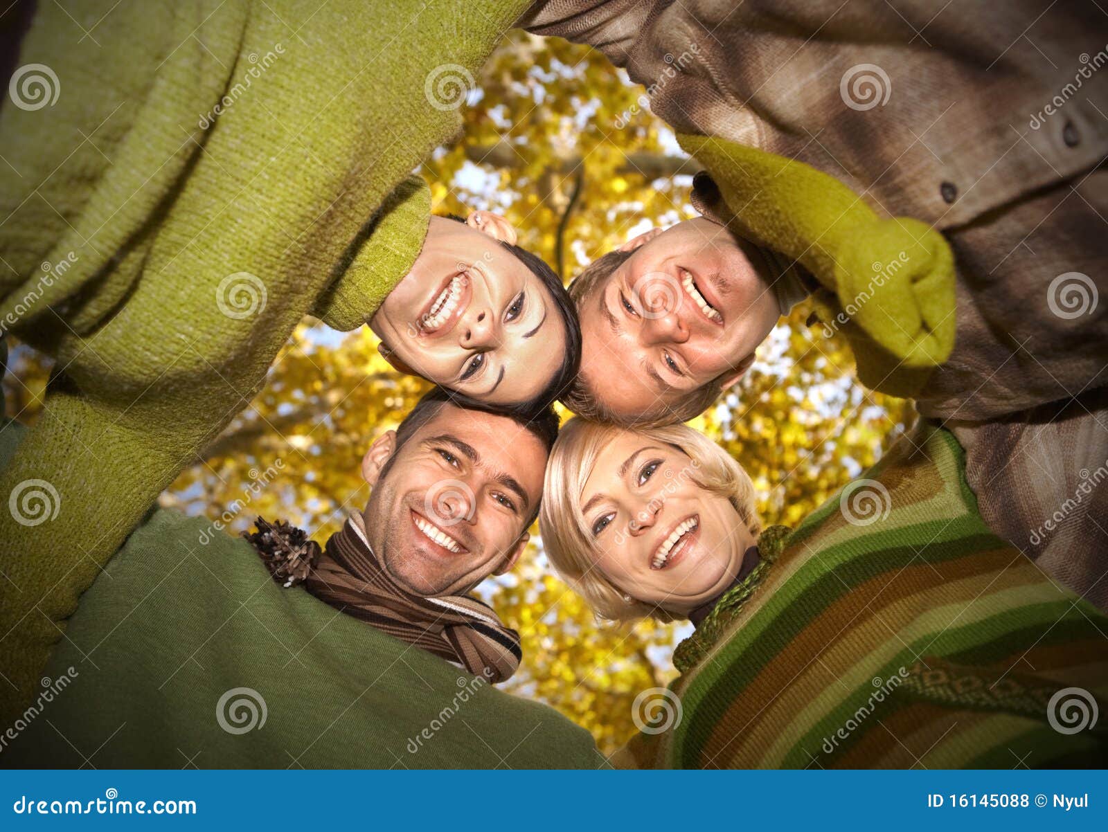 Group of Happy Friends with Heads Together Stock Photo - Image of green ...