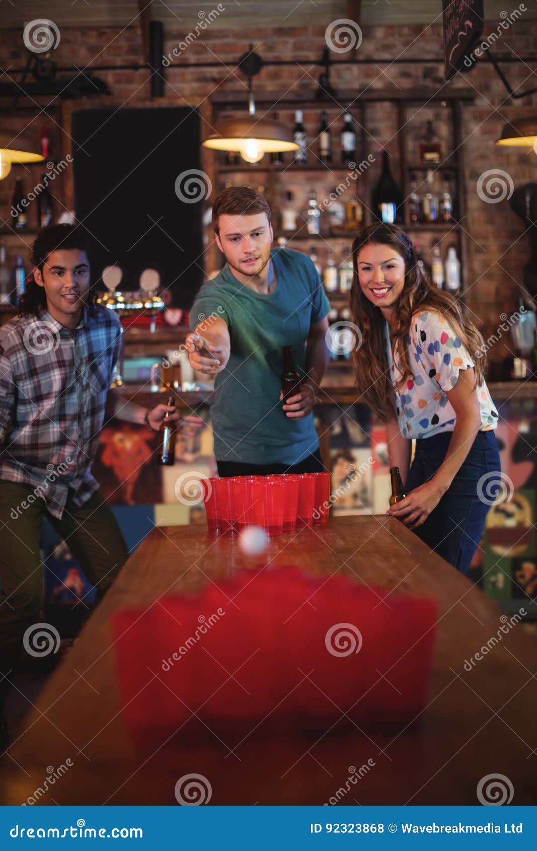 Group of Happy Friends Playing Beer Pong Game Stock Photo - Image of ...