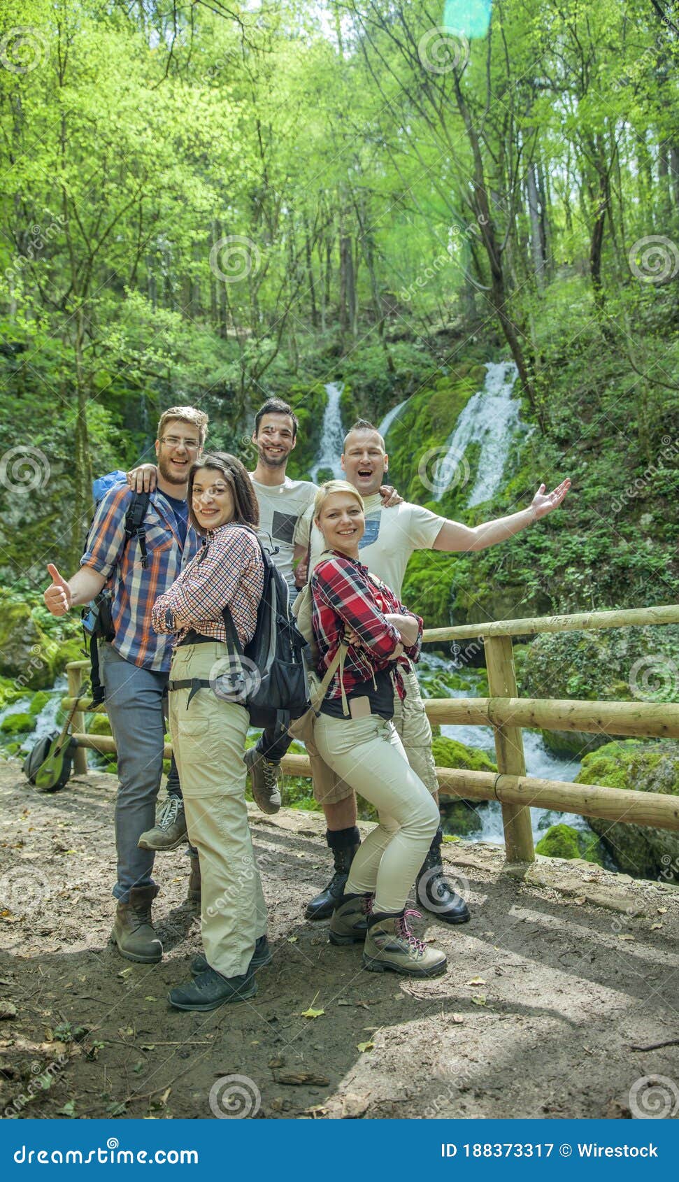 Group of Happy Friends Posing in Nature in Front of a Waterfall Stock ...