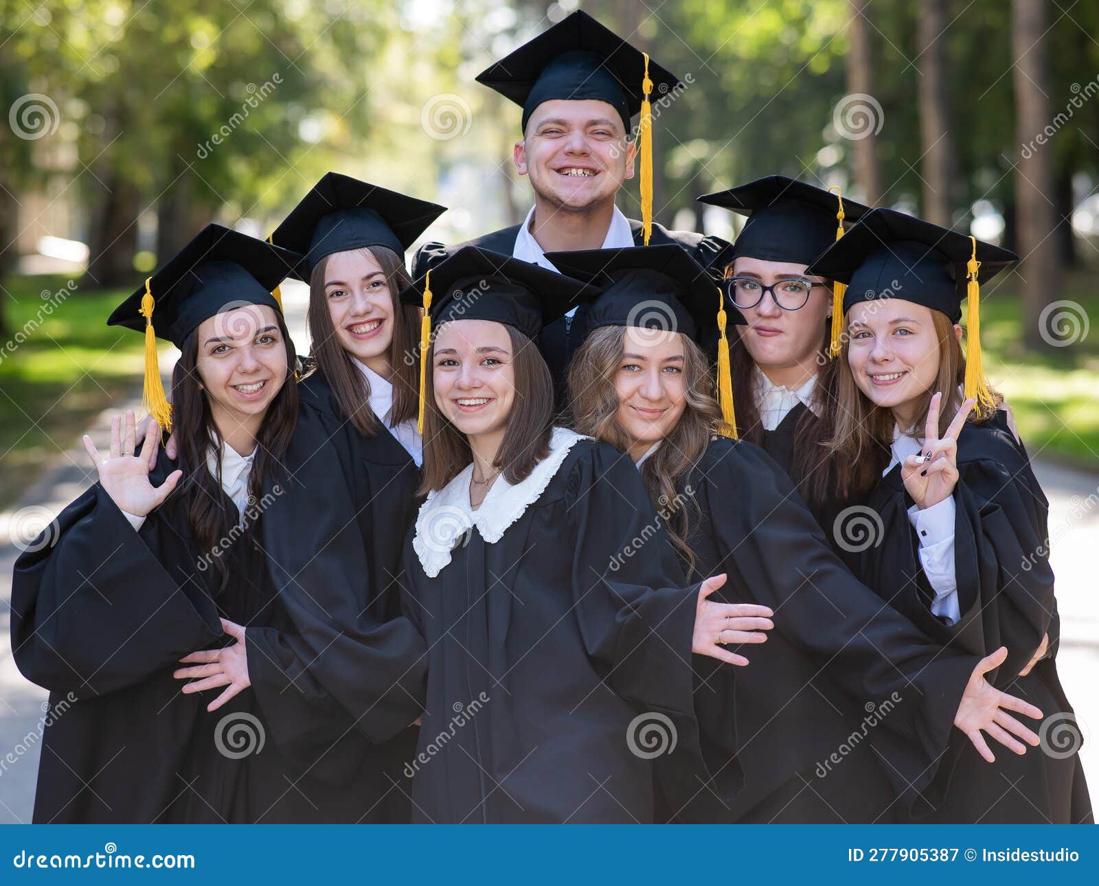 Group of Happy Graduates in Robes Outdoors. Stock Image - Image of ...