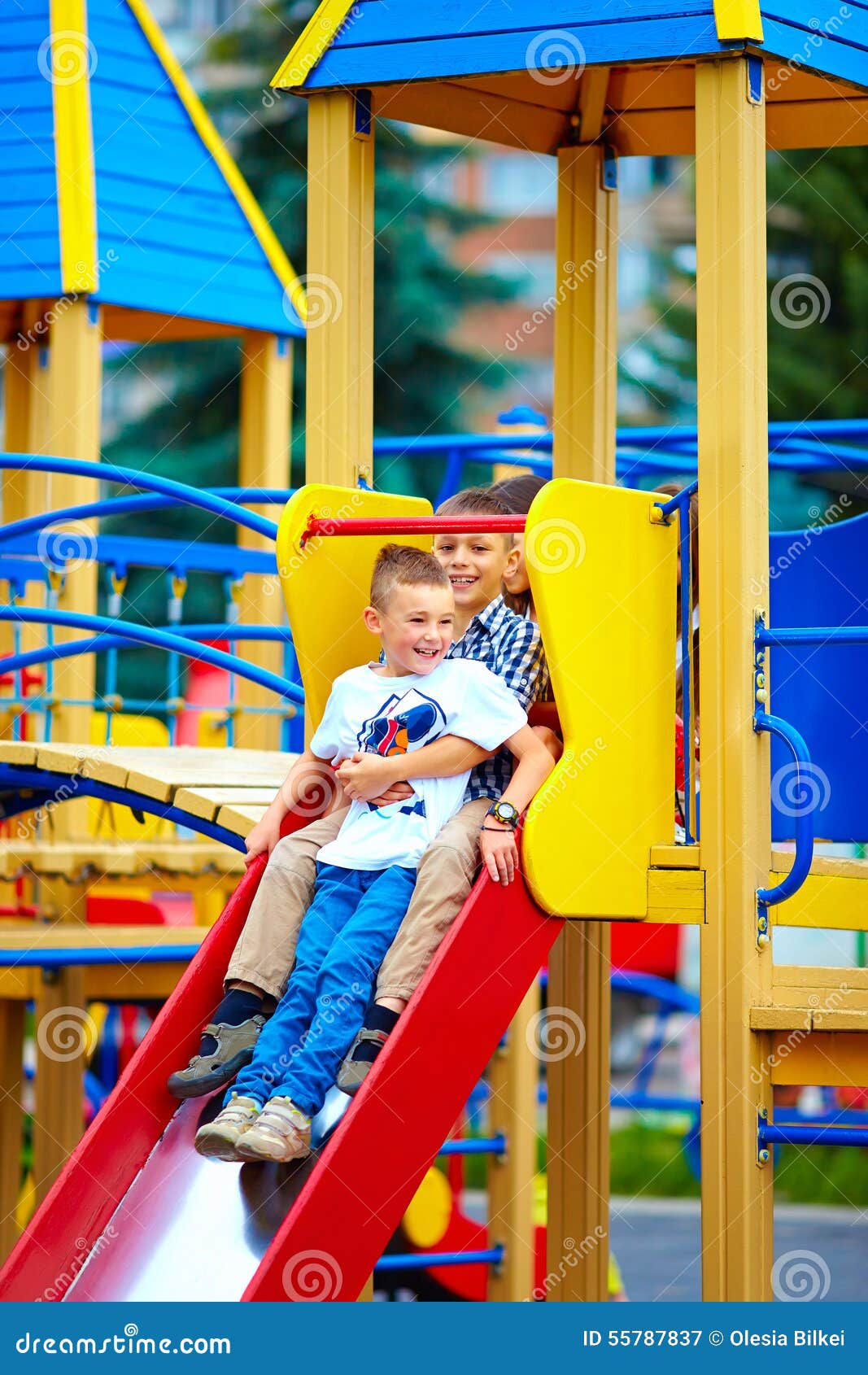 Group of Happy Kids Sliding in Colorful Playground Stock Image - Image ...