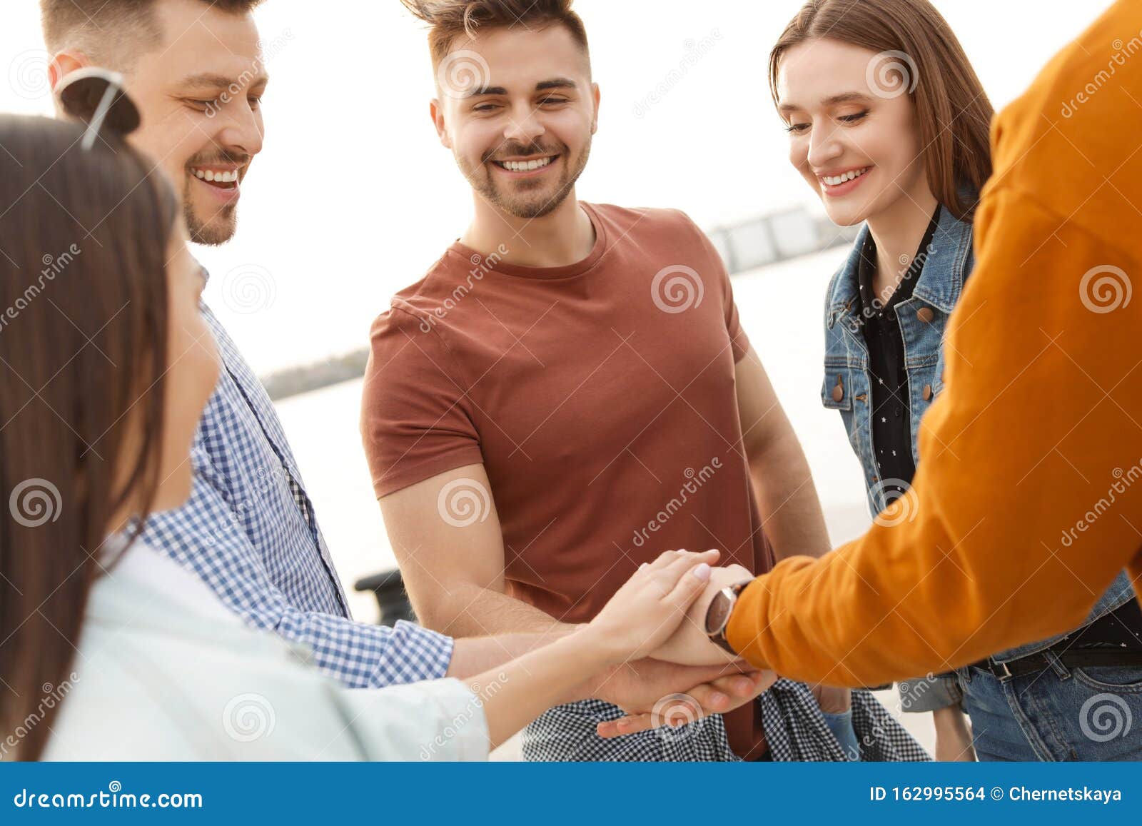 Group of Happy People Holding Hands Together Stock Photo - Image of ...