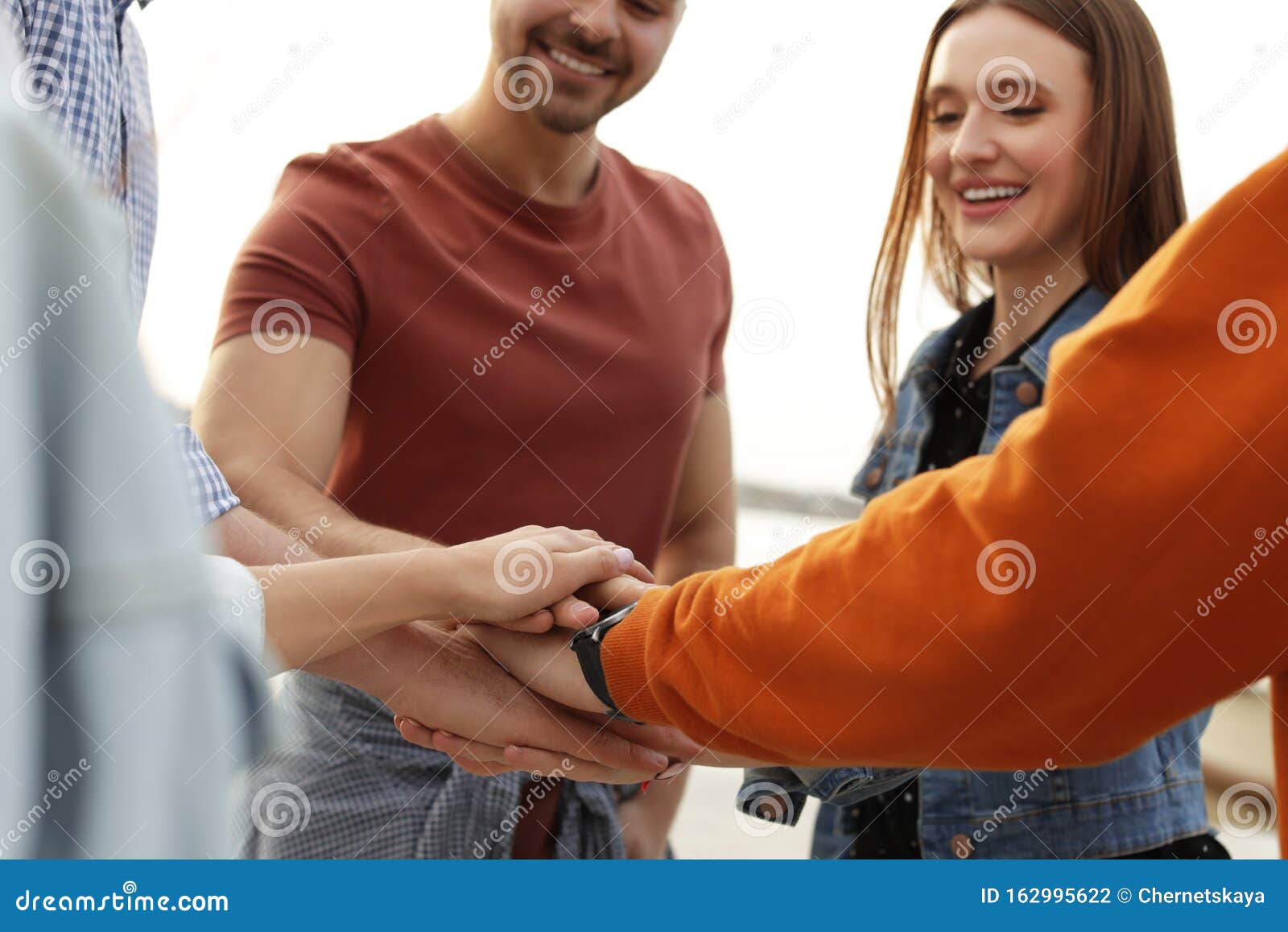 Group of Happy People Holding Hands Together Stock Photo - Image of ...