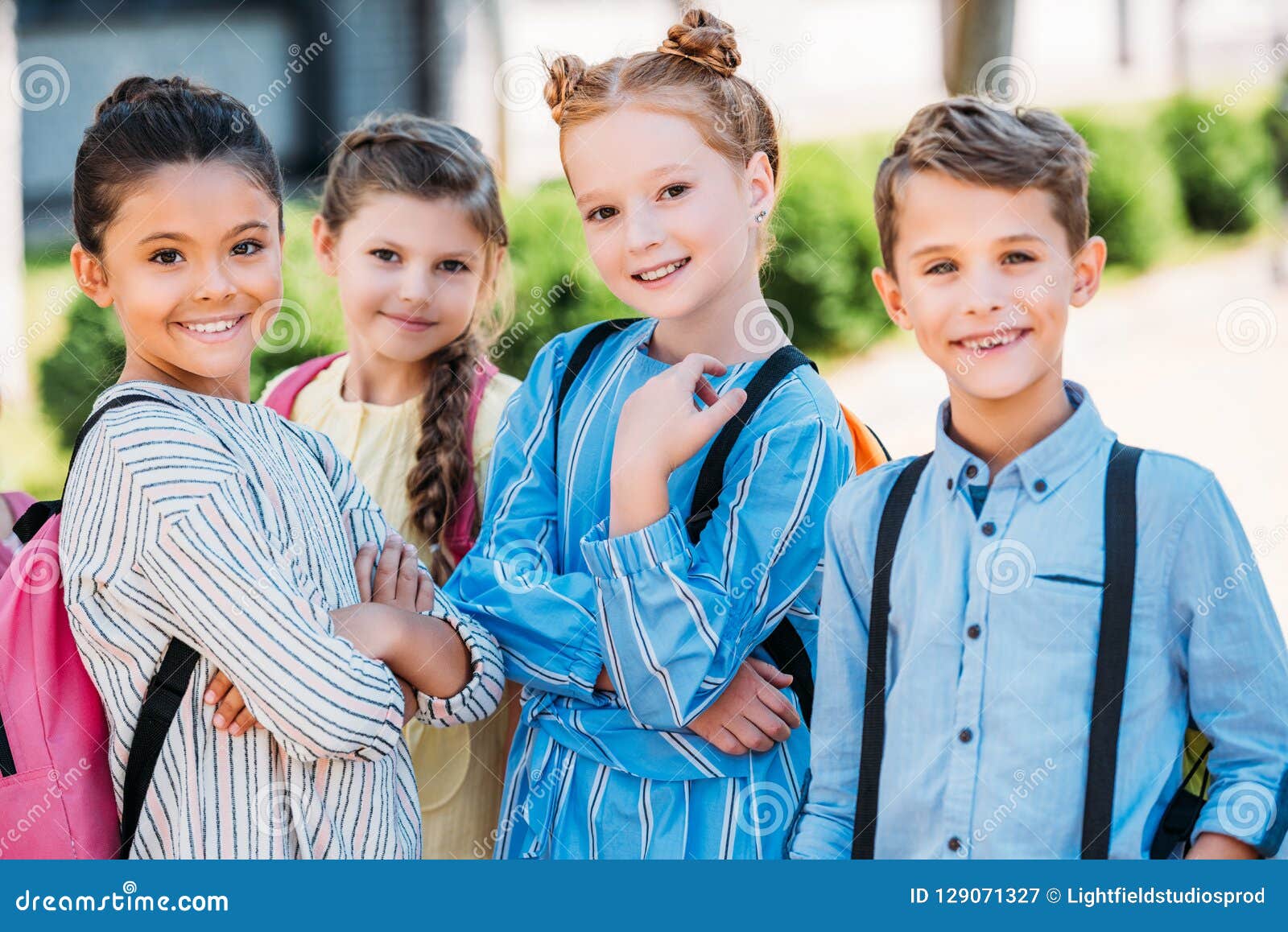 Group of Happy Schoolchildren with Backpacks Looking Stock Image ... Group of Happy Schoolchildren with Backpacks Looking Stock Image ...