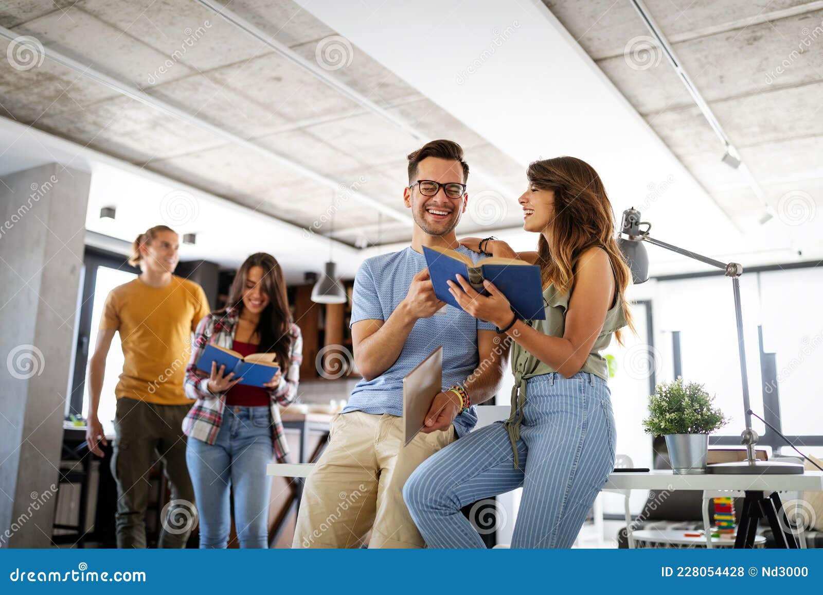 Group of Happy Young Students Having Fun while Studying Together for ...