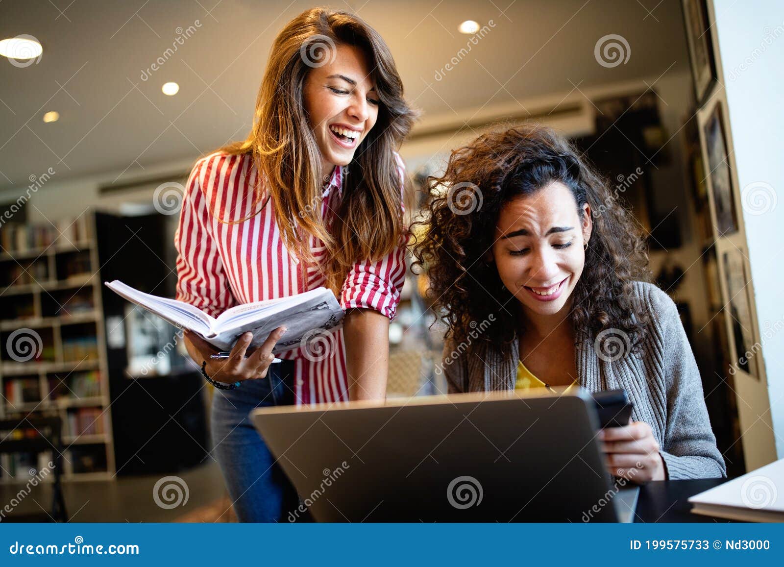 Group of Happy Students Reading Books and Preparing To Exam in Library ...