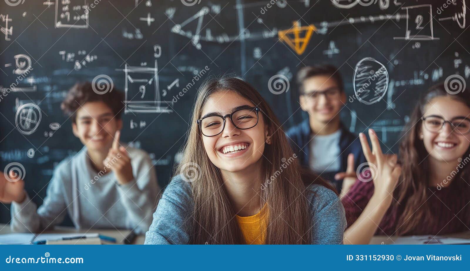 Happy Students Smiling in Classroom with Chalkboard Background Stock ...