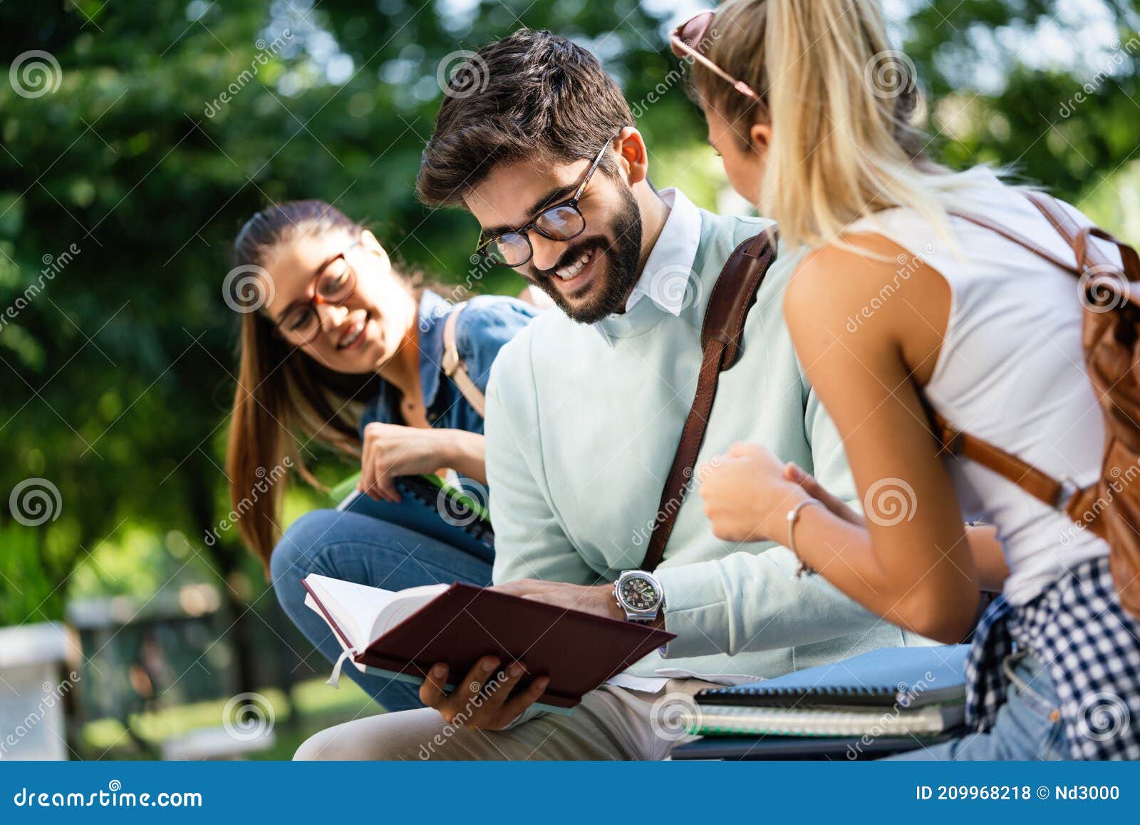 Group of Happy Students Studying, Preparing Together for Exam Ourdoor ... Group of Happy Students Studying, Preparing Together for Exam Ourdoor ...