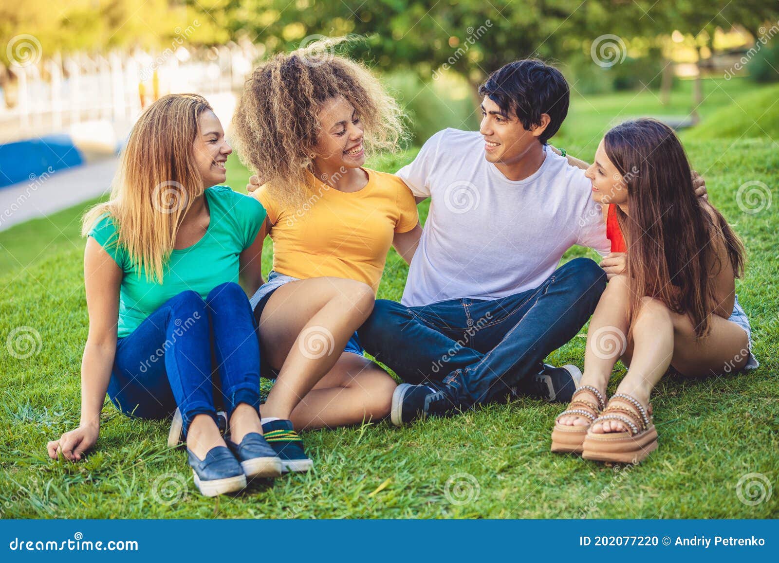 Group of Happy Teenagers in the Park Stock Photo - Image of sitting ...