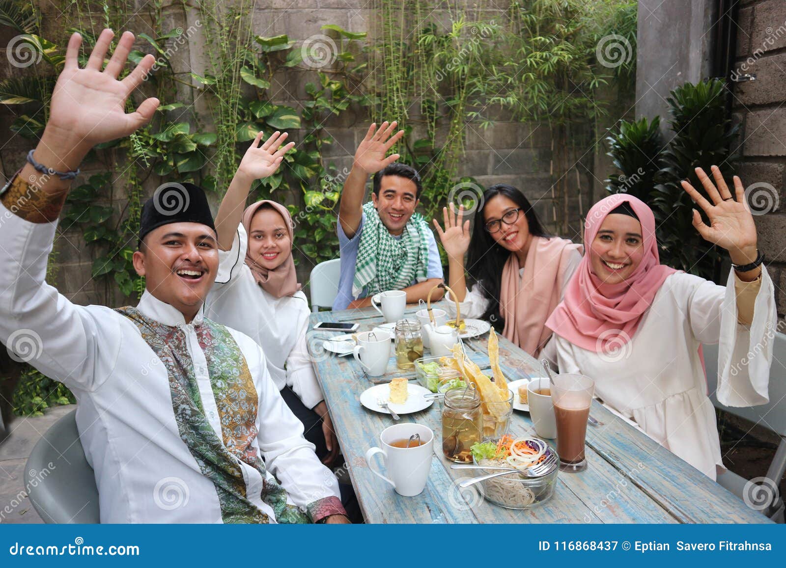 Group Happy Young Muslim Waving at Table Dining during Ramadan C Stock ...