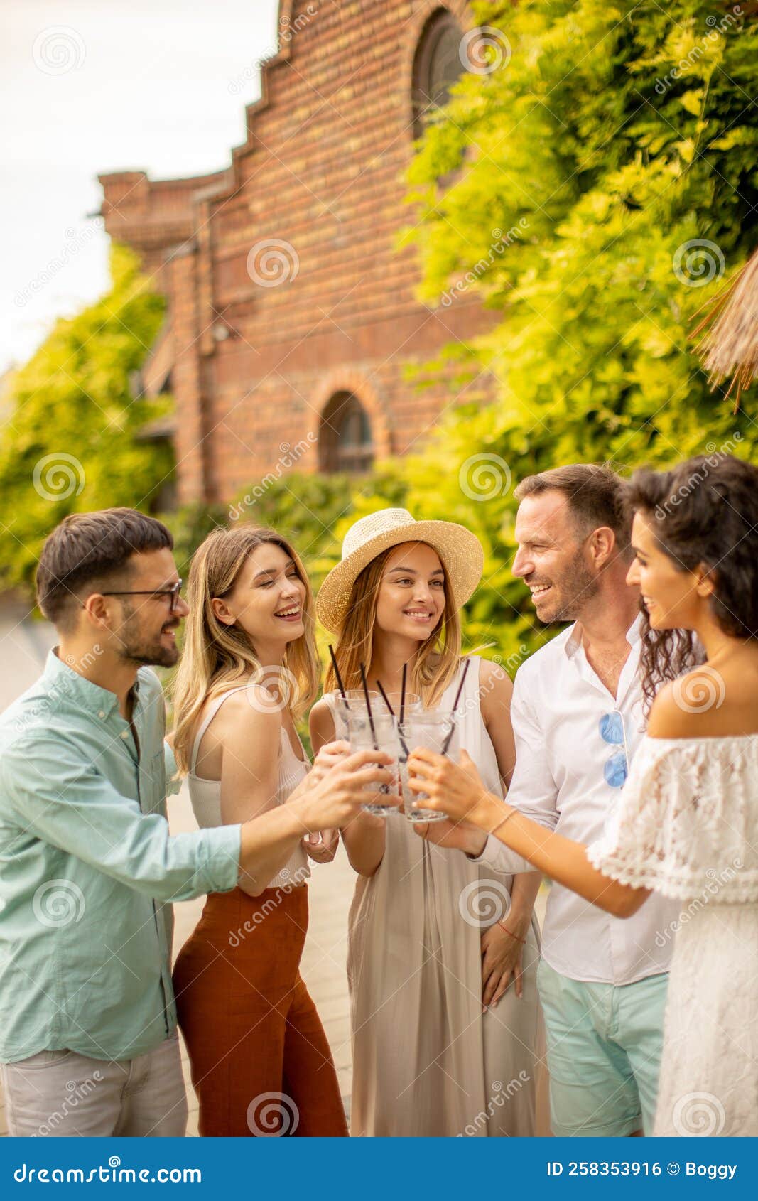 Group of Happy Young People Cheering with Fresh Lemonade in the Garden ...