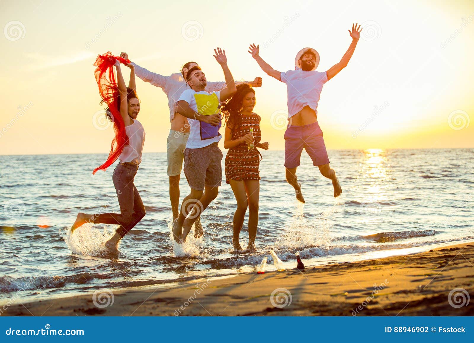 Group of Happy Young People Dancing at the Beach on Beautiful Summer ...