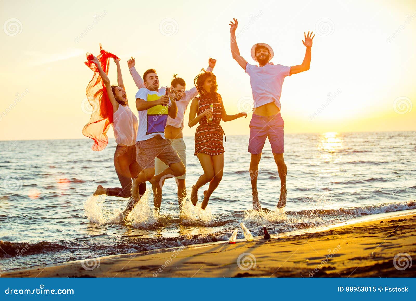 Group of Happy Young People Dancing at the Beach on Beautiful Summer ...