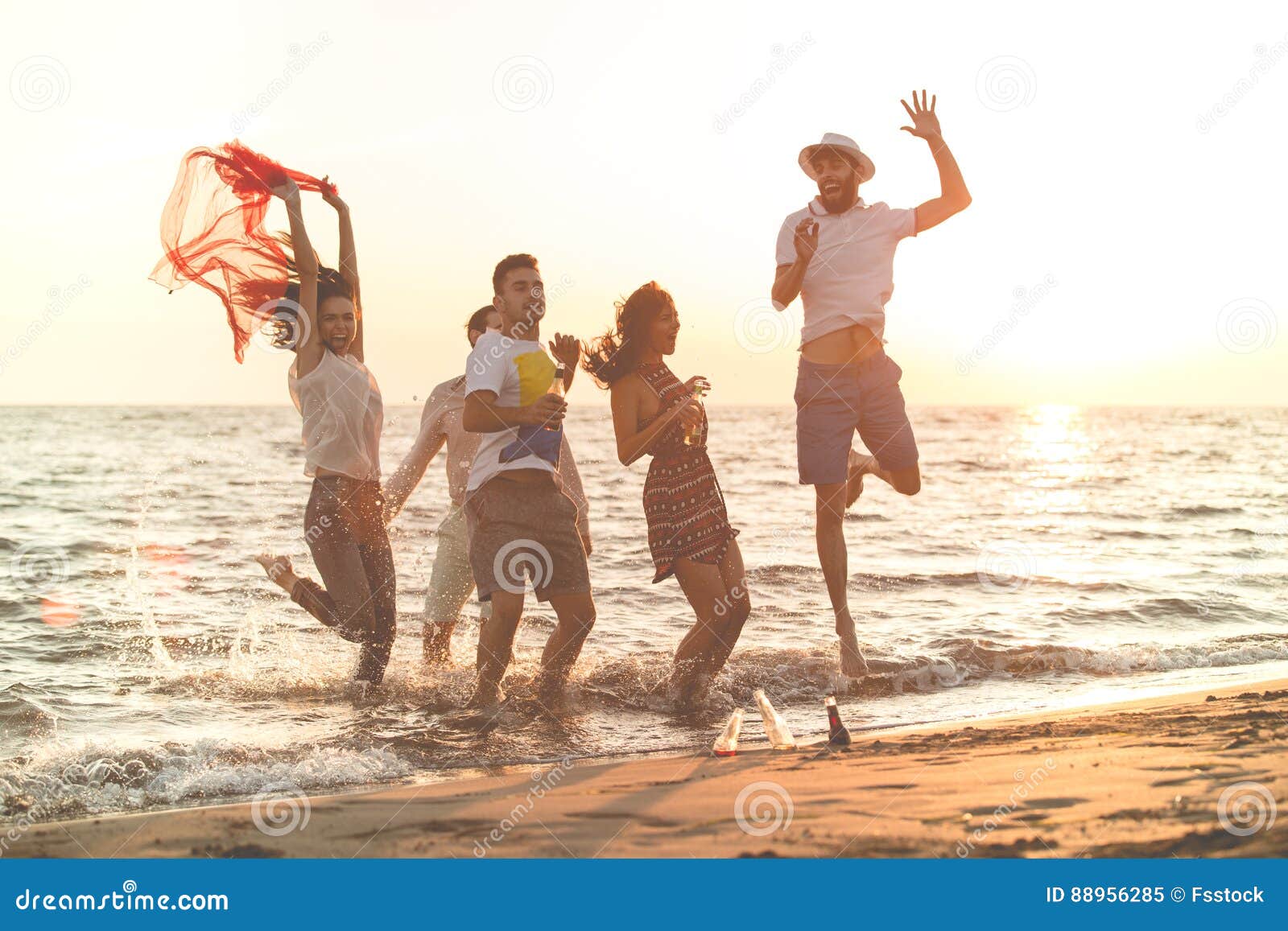 Group of Happy Young People Dancing at the Beach on Beautiful Summer ...