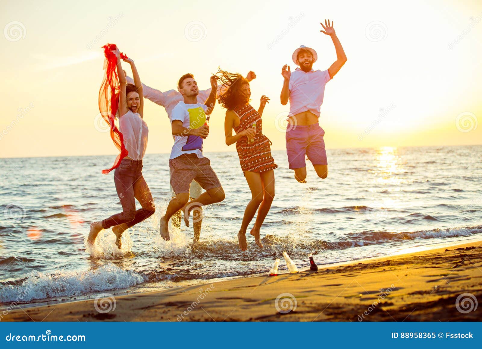 Group of Happy Young People Dancing at the Beach on Beautiful Summer ...