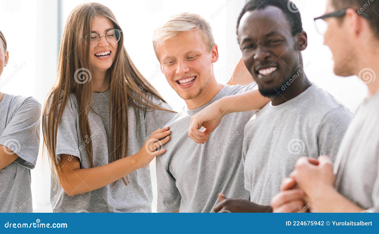 Group of Happy Young People Standing in a Bright Room Stock Photo ...