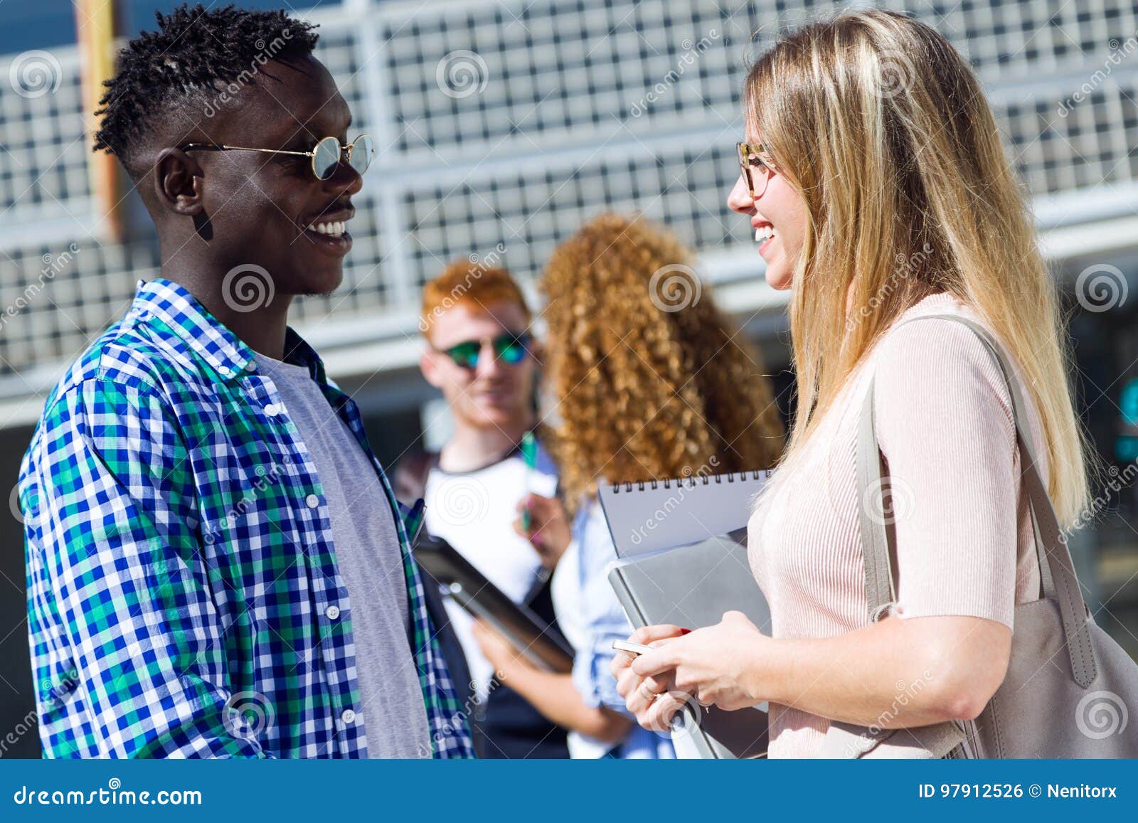 Group of Happy Young Students Speaking in a University. Stock Photo ...