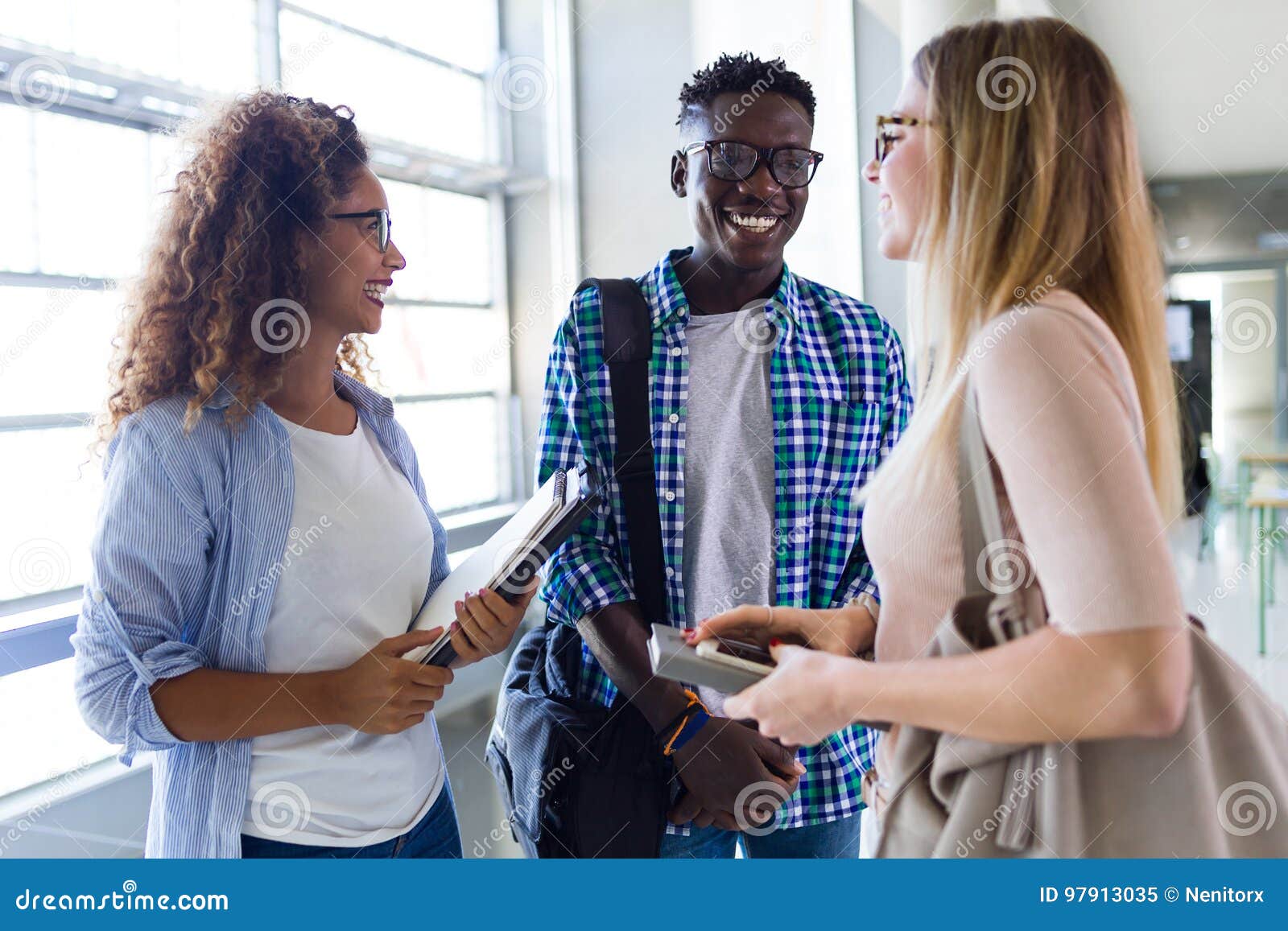 Group of Happy Young Students Speaking in a University. Stock Image ...