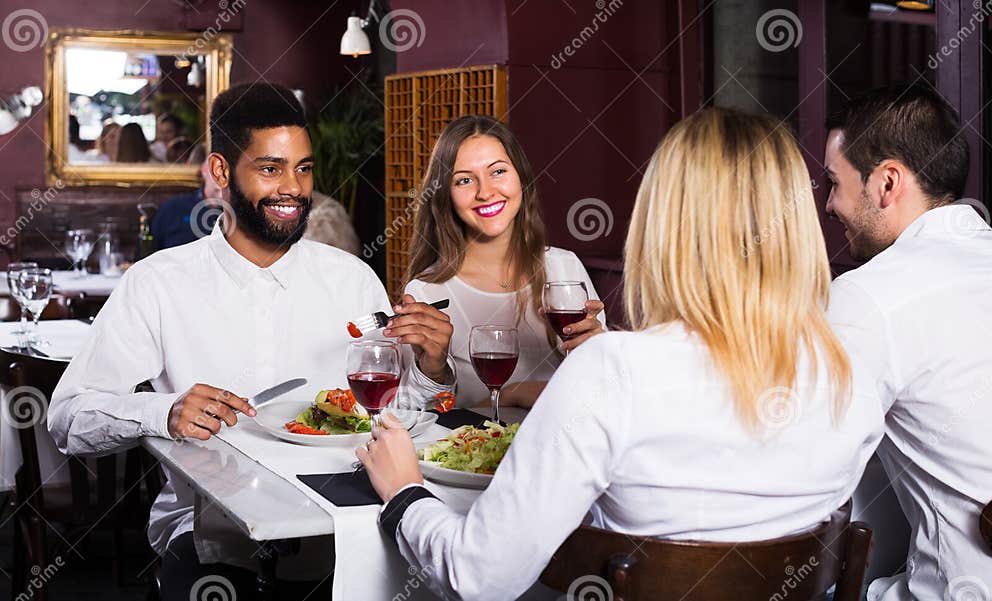 Group Having Dinner in Restauran Stock Photo - Image of hanging, group ...