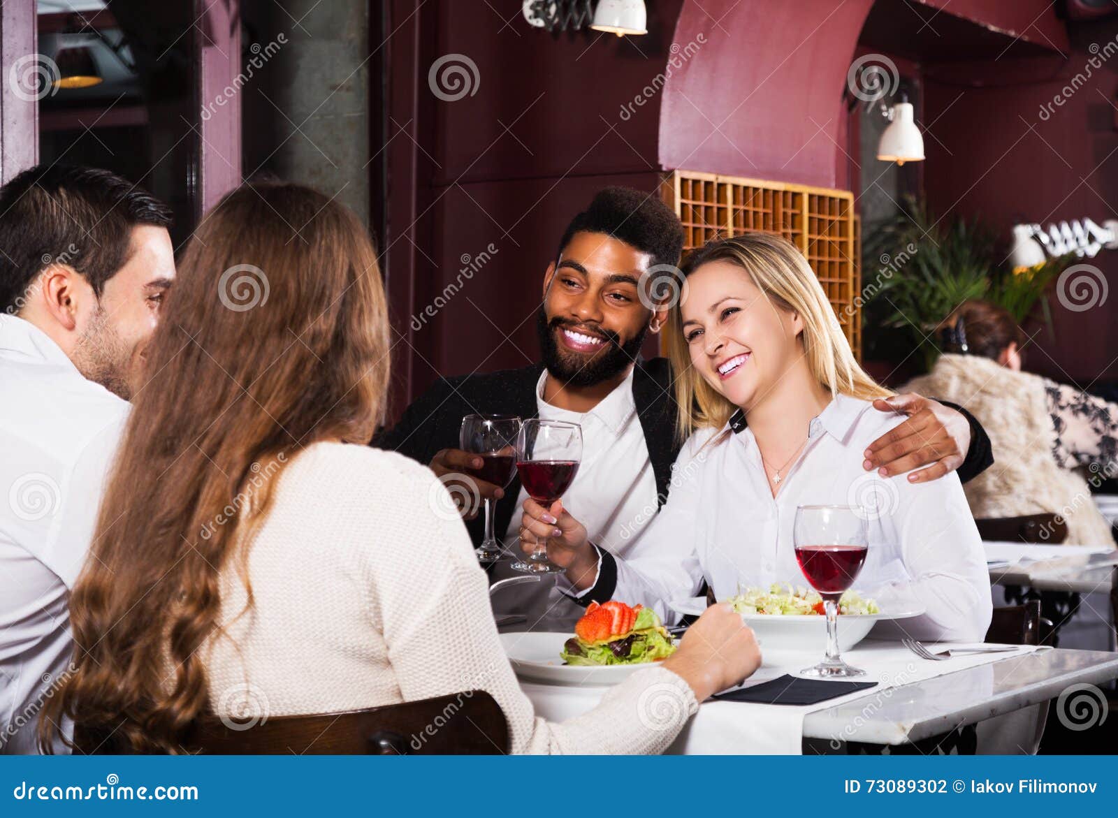 Group Having Dinner in Restauran Stock Photo - Image of girlfriend ...