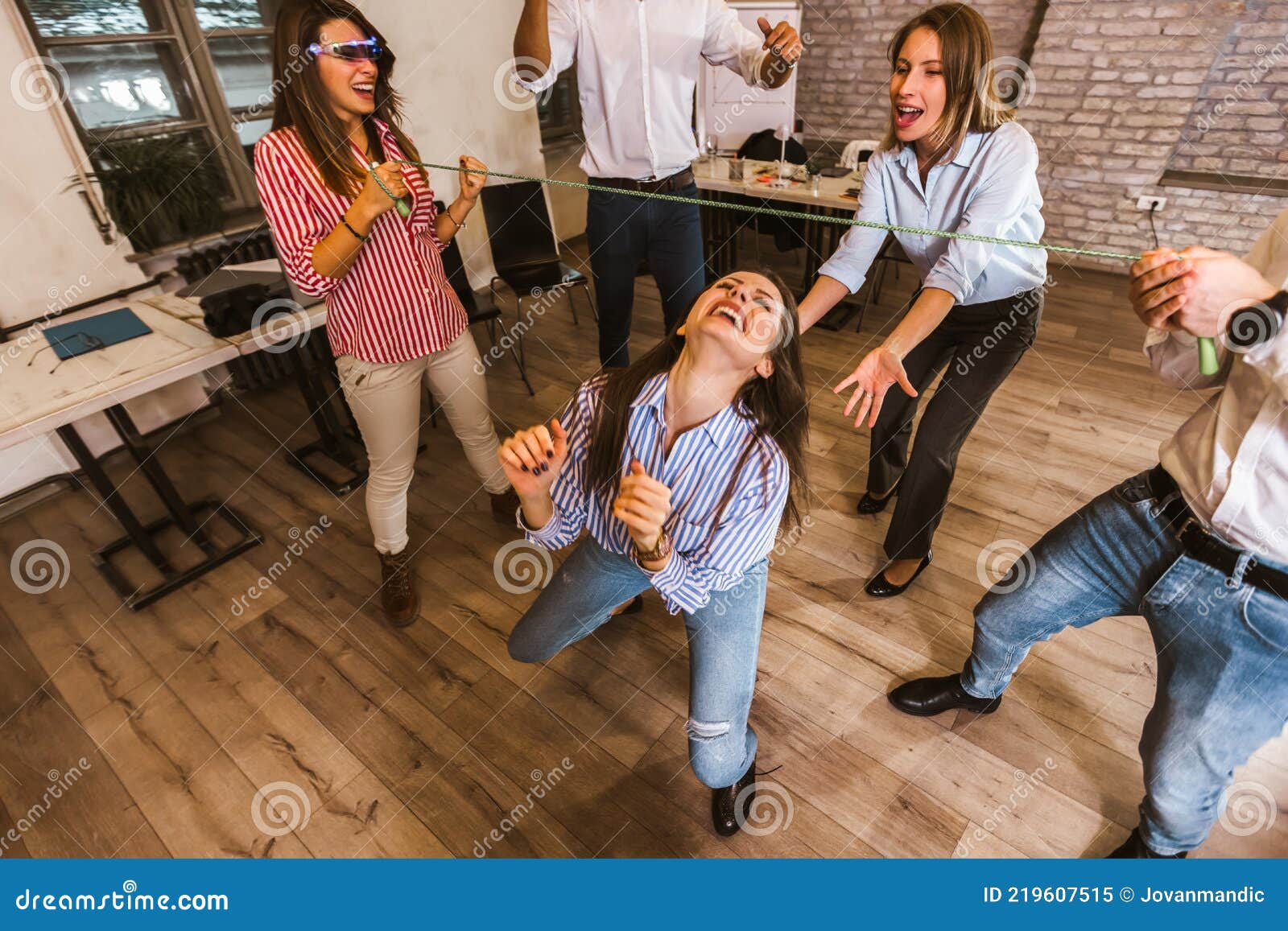 Group Having Fun Together with Limbo Game at Office Party Stock Image ...