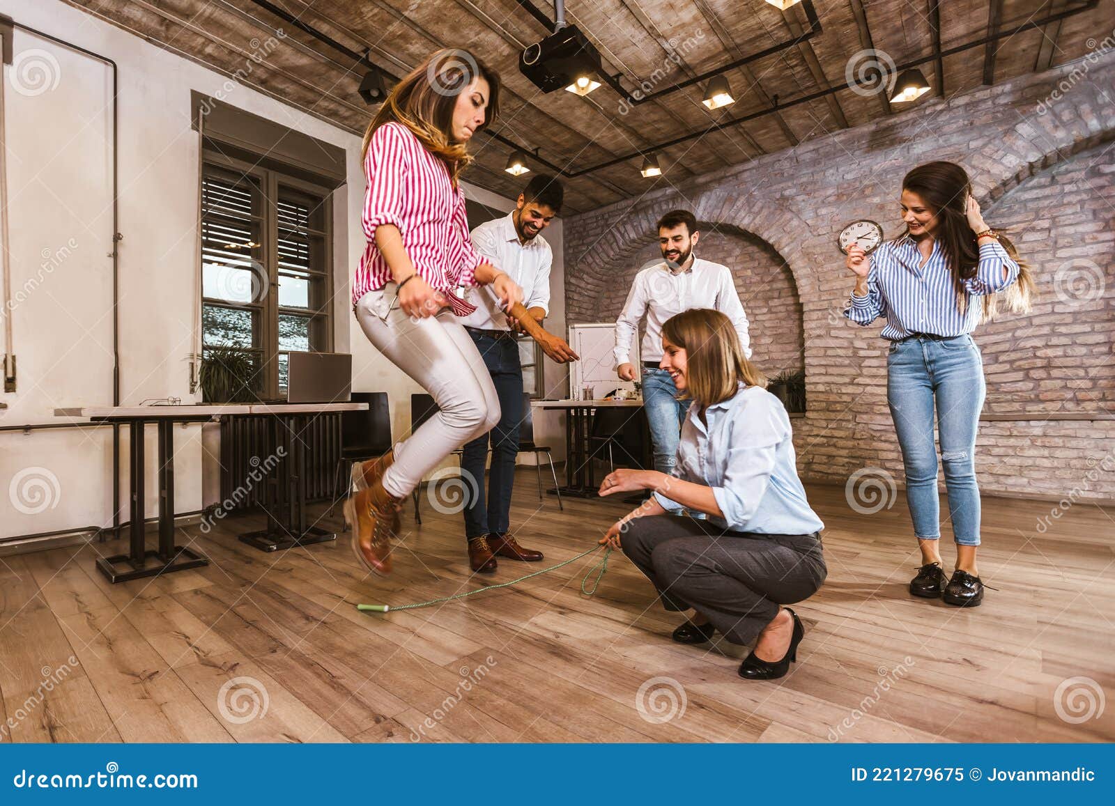 Group Having Fun Together with Limbo Game at Office Party Stock Image ...
