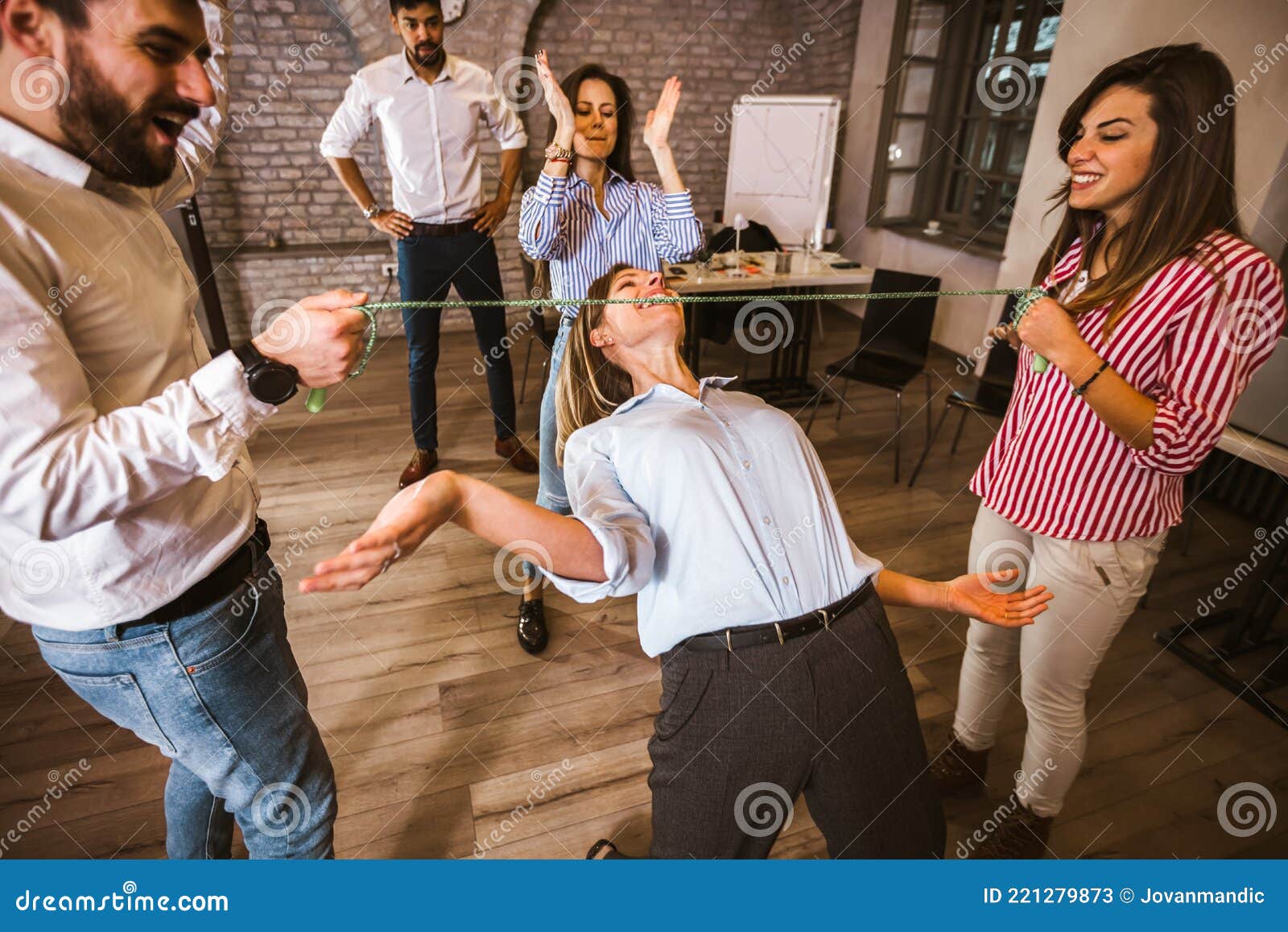 Group Having Fun Together with Limbo Game at Office Party Stock Image ...