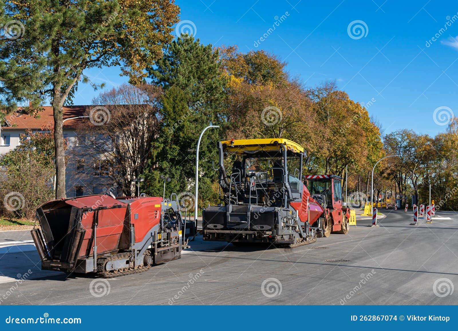 A Group of Heavy Asphalt Pavers on a Newly Made Road Stock Photo ...