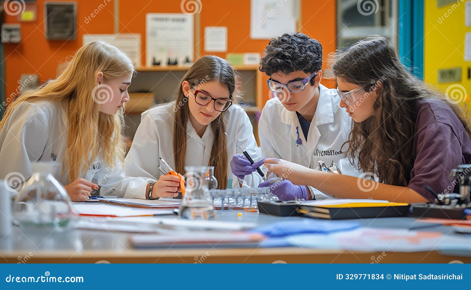 A Group of High School Students Collaborating on a Science Project ...